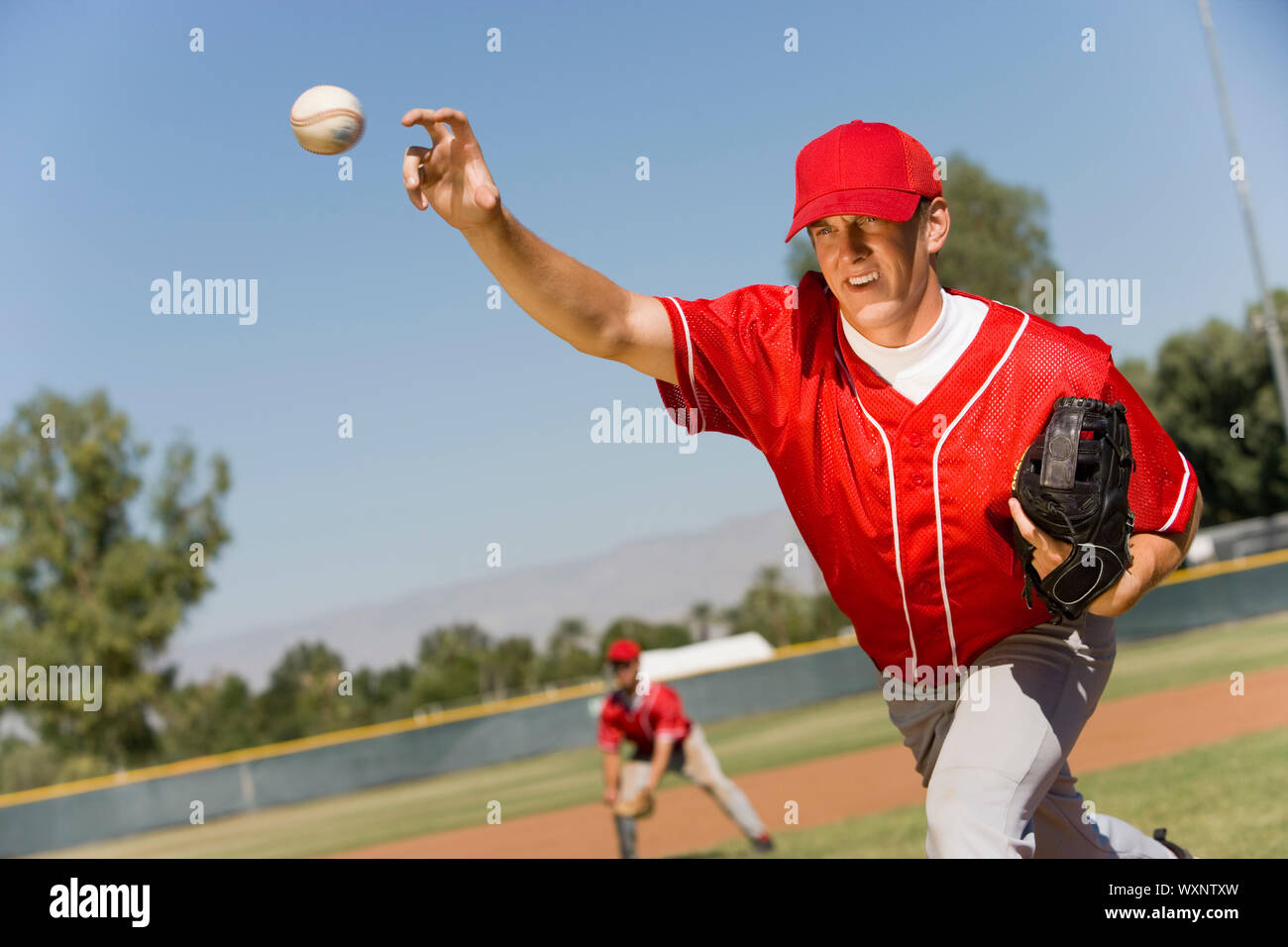 Teen boy pitching baseball hi-res stock photography and images - Alamy