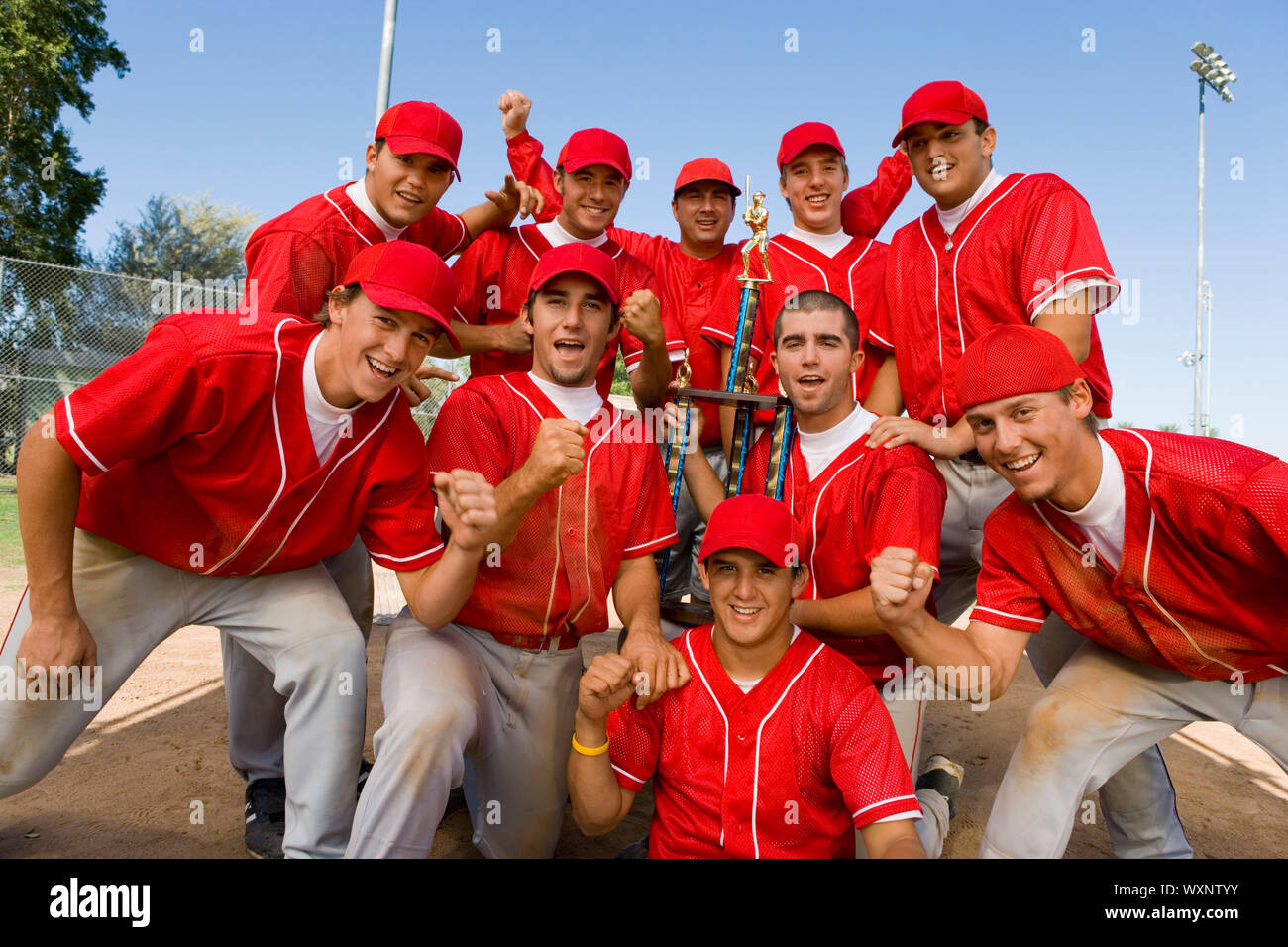 Teammates Holding Trophy Stock Photo - Alamy