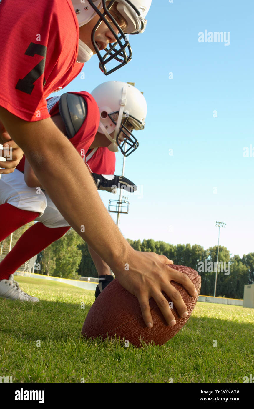 Center with Football and Offensive Tackle Stock Photo - Alamy