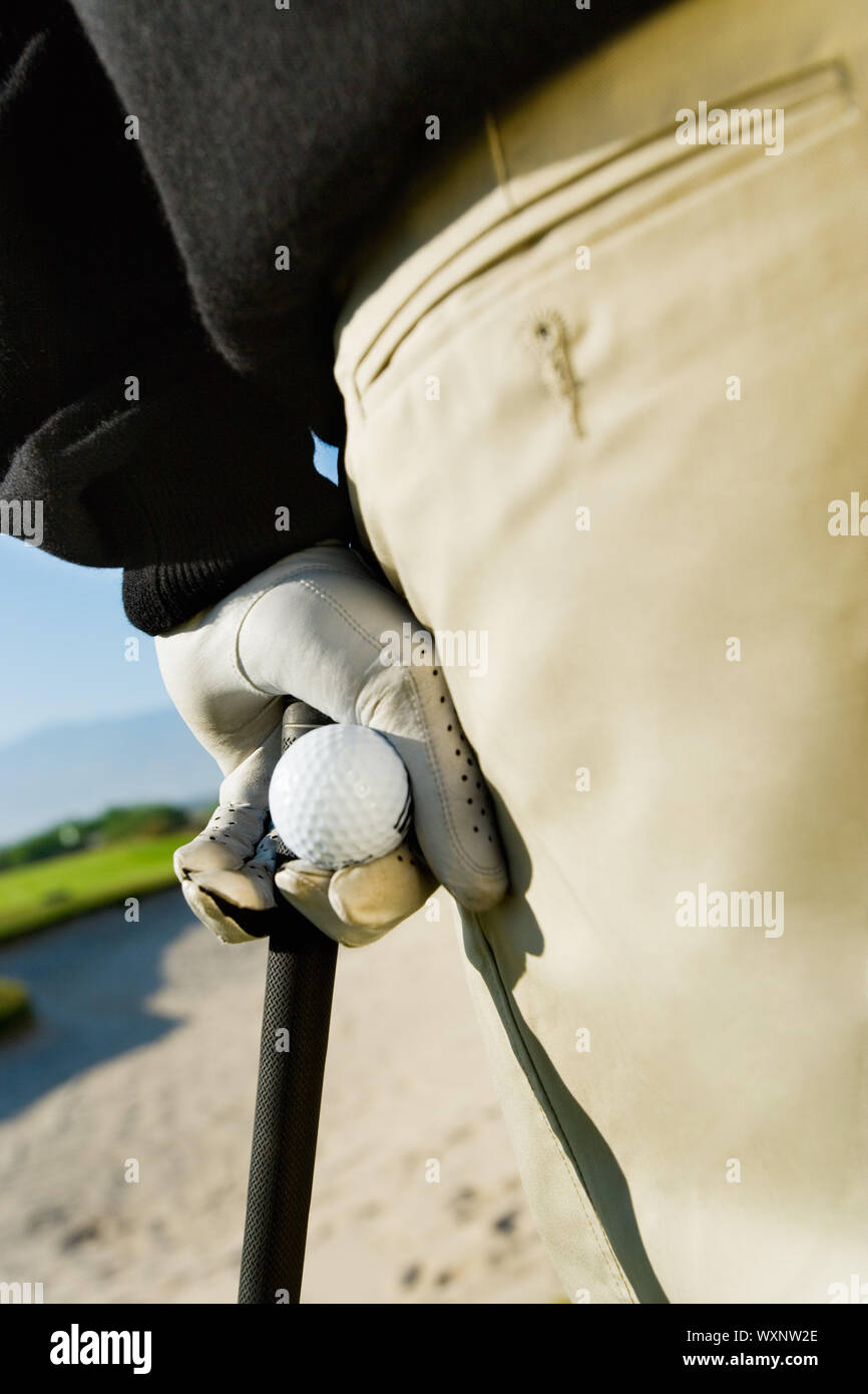 Hand Holding Golf Ball and Club Stock Photo - Alamy