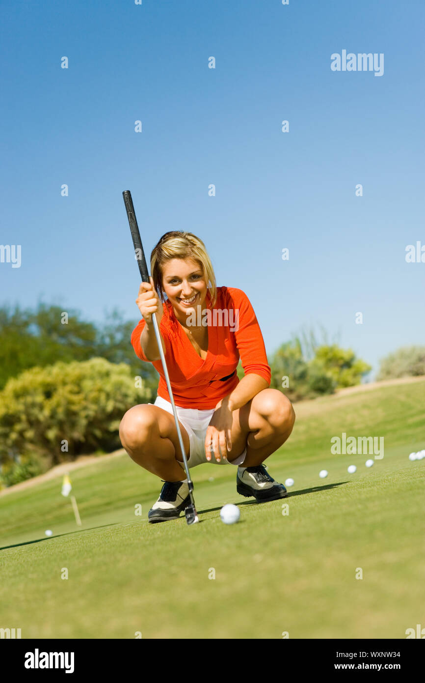 Golfer Lining Up Put on Practice Green Stock Photo - Alamy