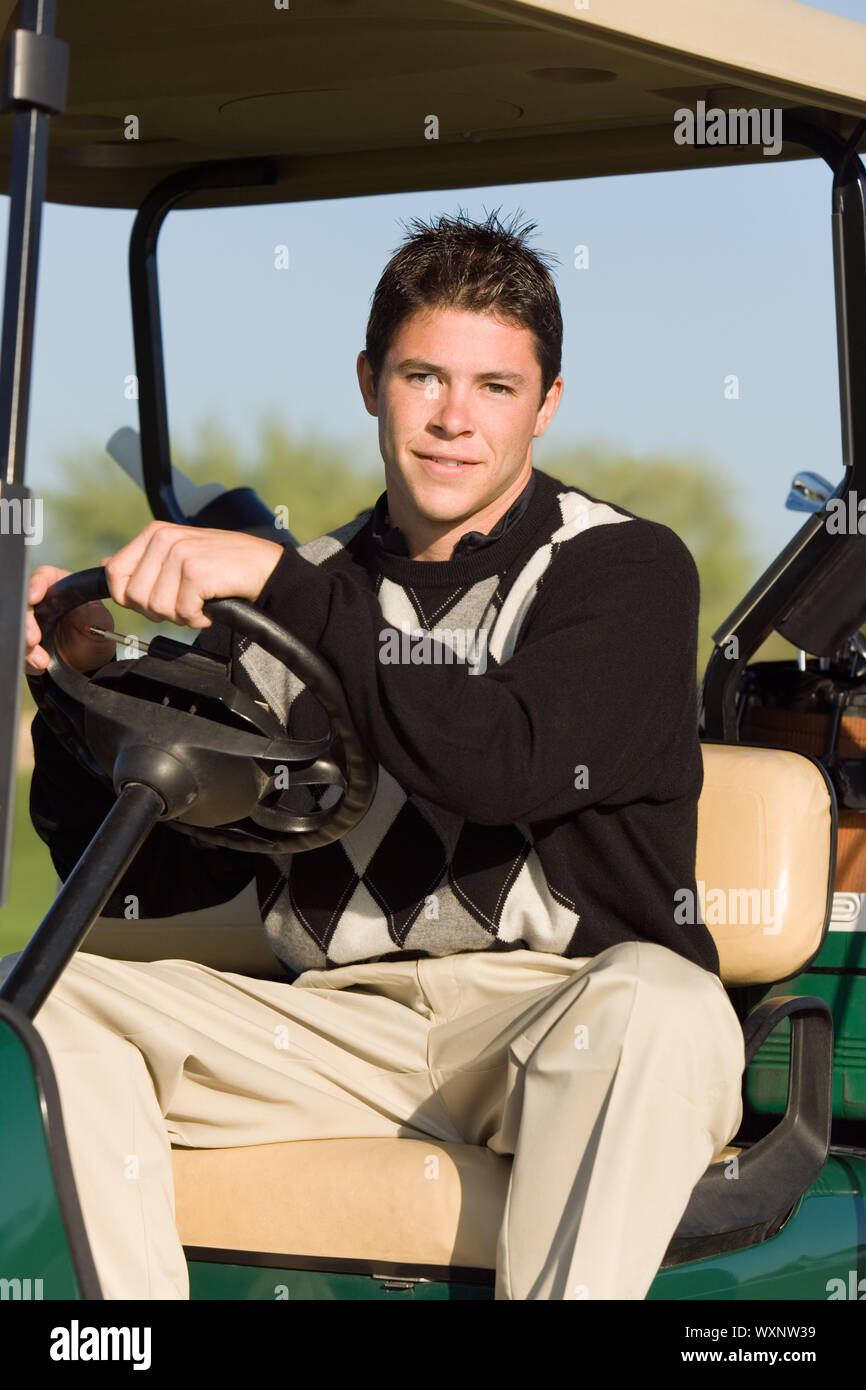 Golfer Driving Golf Cart Stock Photo - Alamy