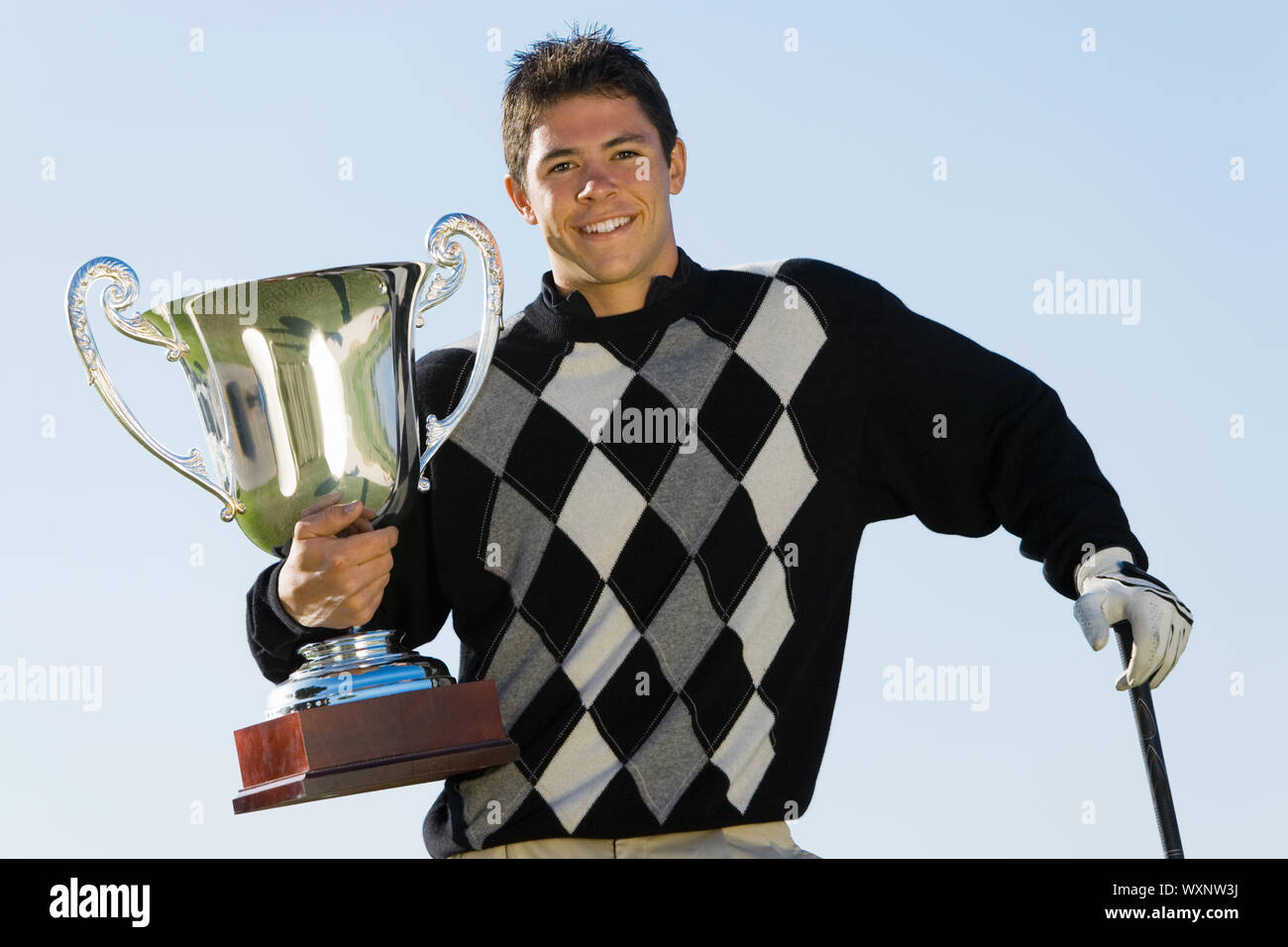 Golf Tournament Champion Holding Trophy Stock Photo - Alamy