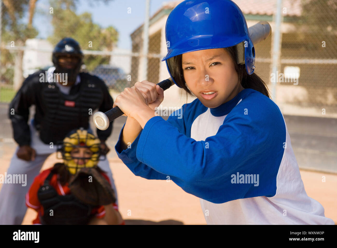 Softball Player at Bat Stock Photo - Alamy