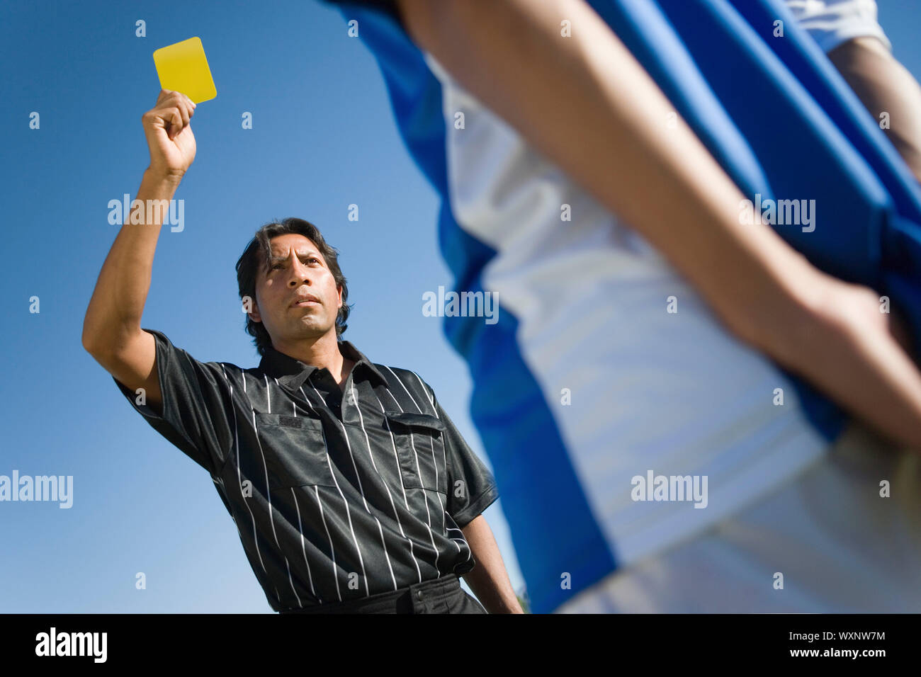 Referee Calling Foul on Soccer Player Stock Photo - Alamy