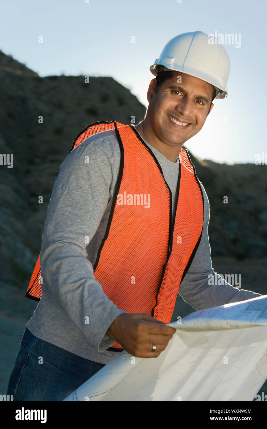 Builder with Plans Stock Photo - Alamy