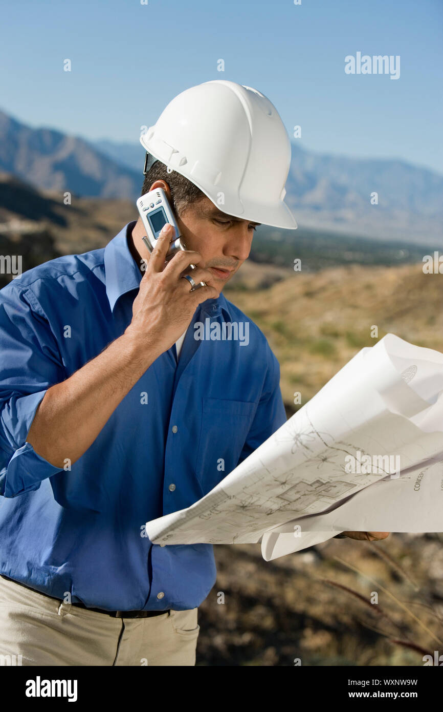 Construction Foreman Using Cell Phone Stock Photo - Alamy