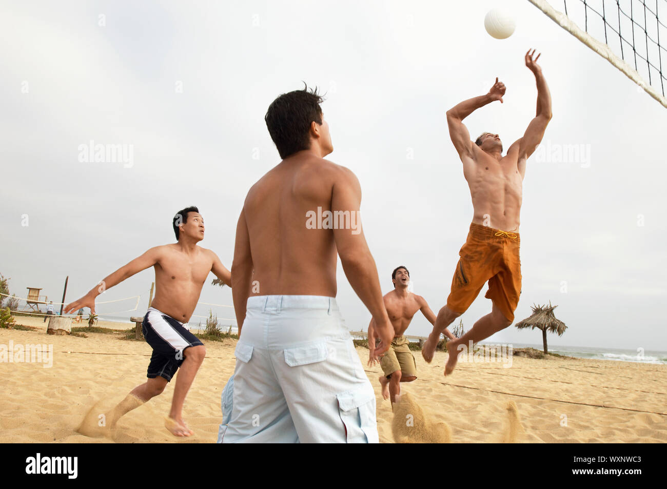 Guy playing volleyball hi-res stock photography and images - Alamy
