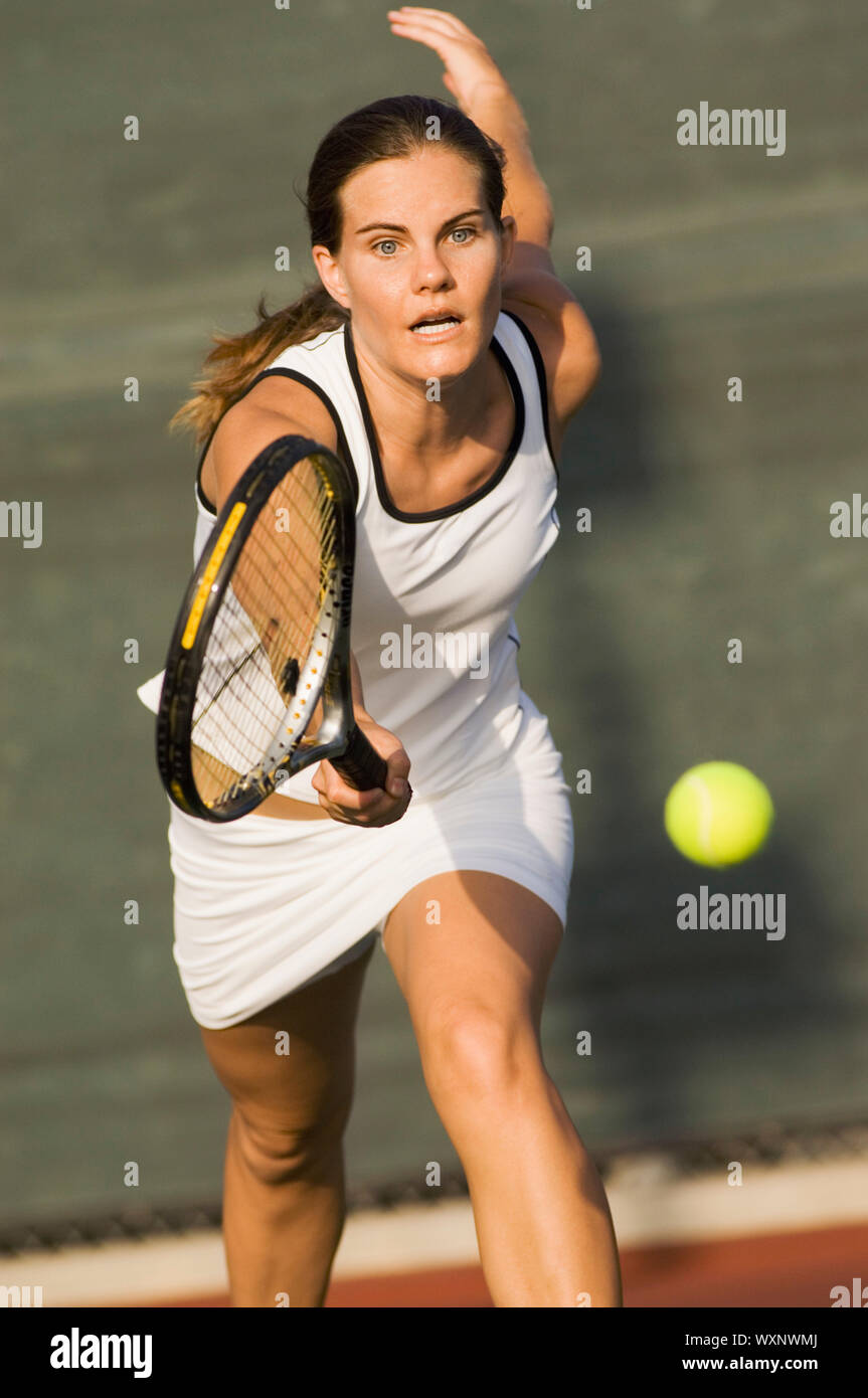 Tennis Player Reaching For Ball Stock Photo - Alamy