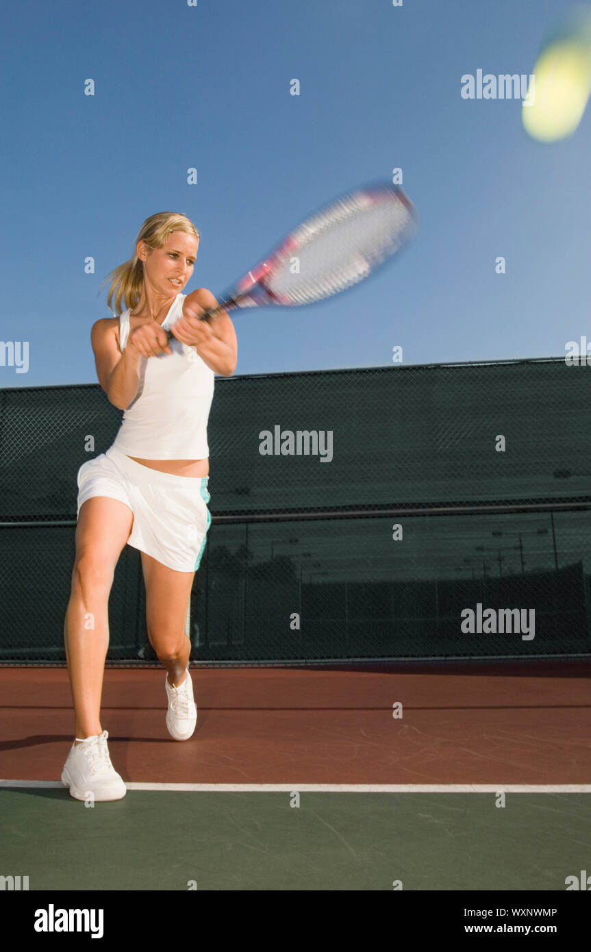 Tennis Player Hitting Backhand Stock Photo - Alamy