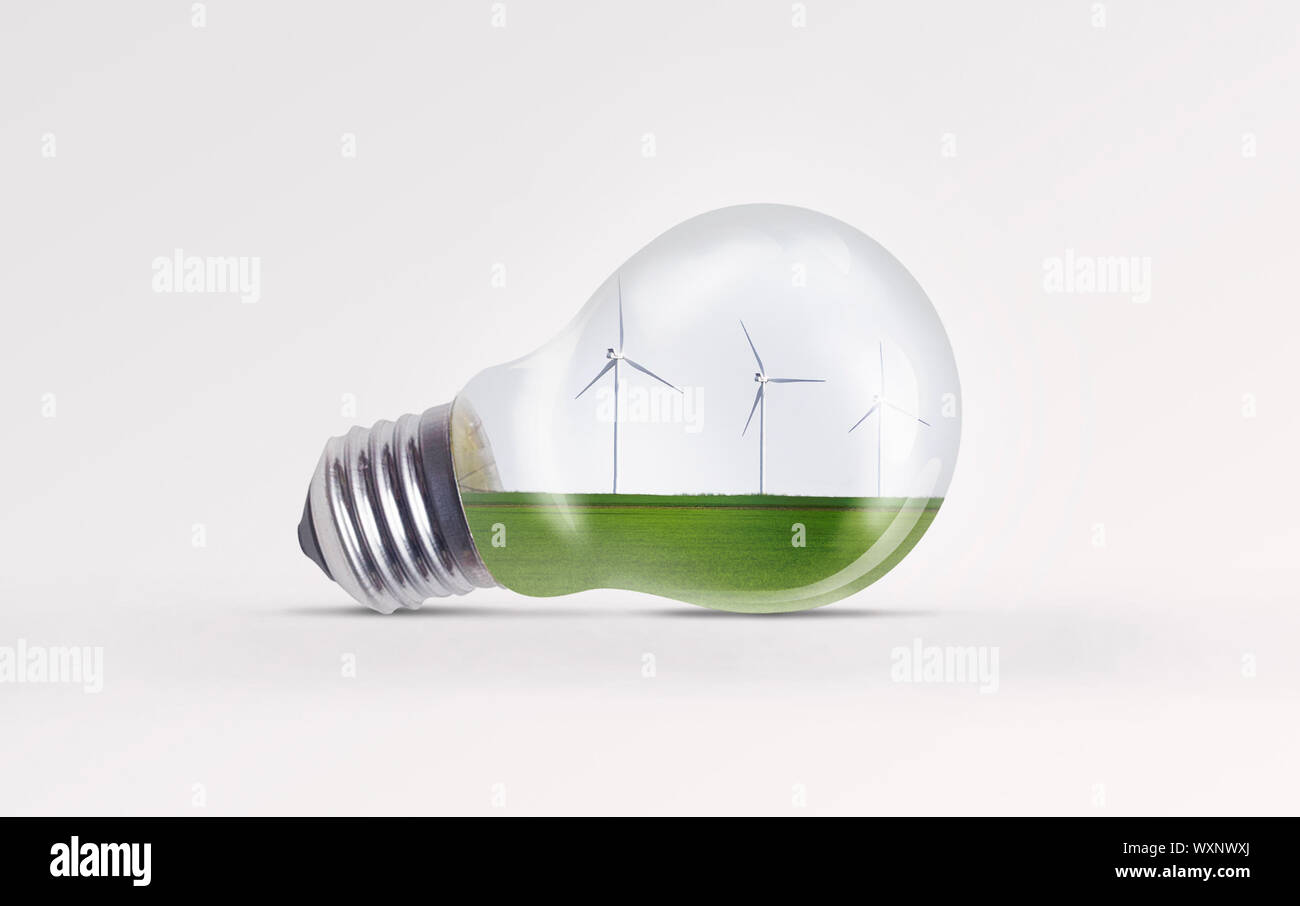 Light bulb with wind turbines inside on white Stock Photo - Alamy