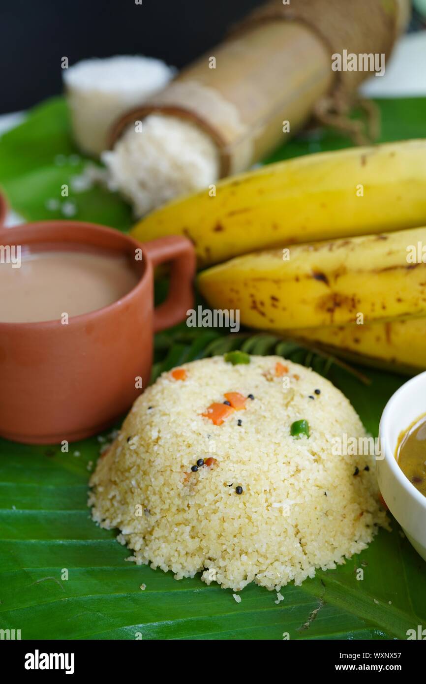 South Indian breakfast Rava Upma, Kerala Puttu, banana and Tea Stock ...
