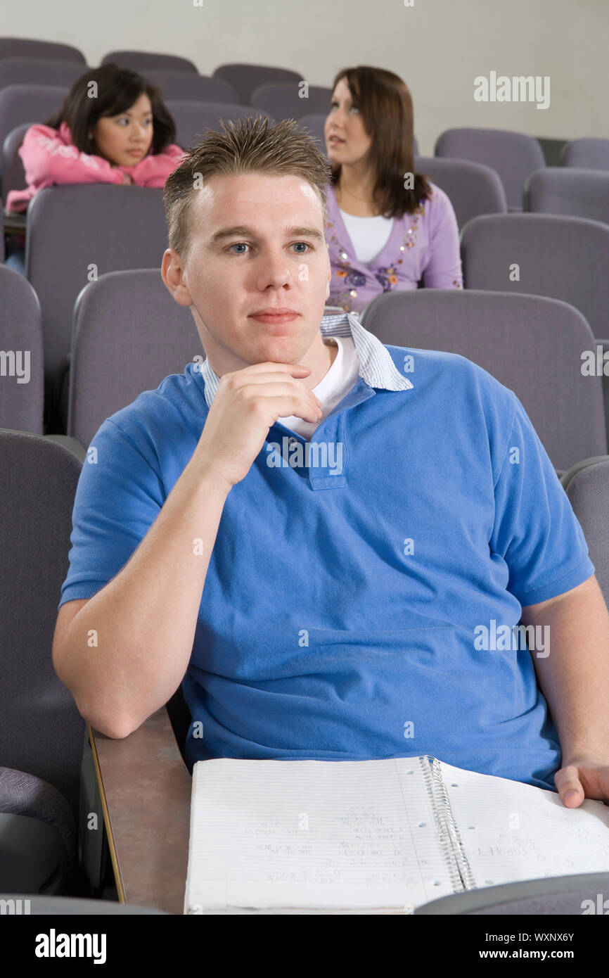 University student sitting in lecture hall Stock Photo - Alamy