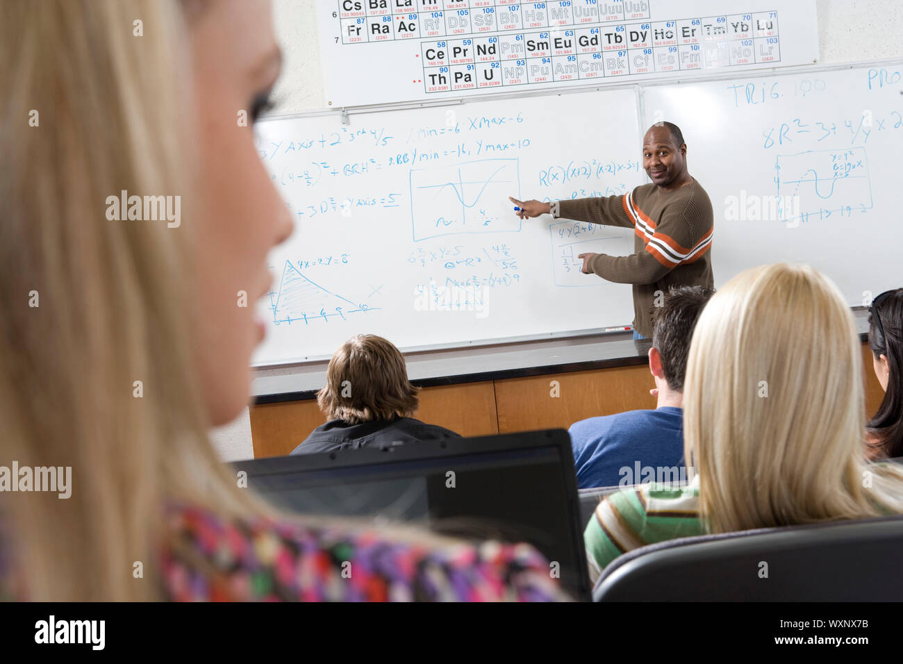 Lecturer teaching University students in classroom Stock Photo - Alamy