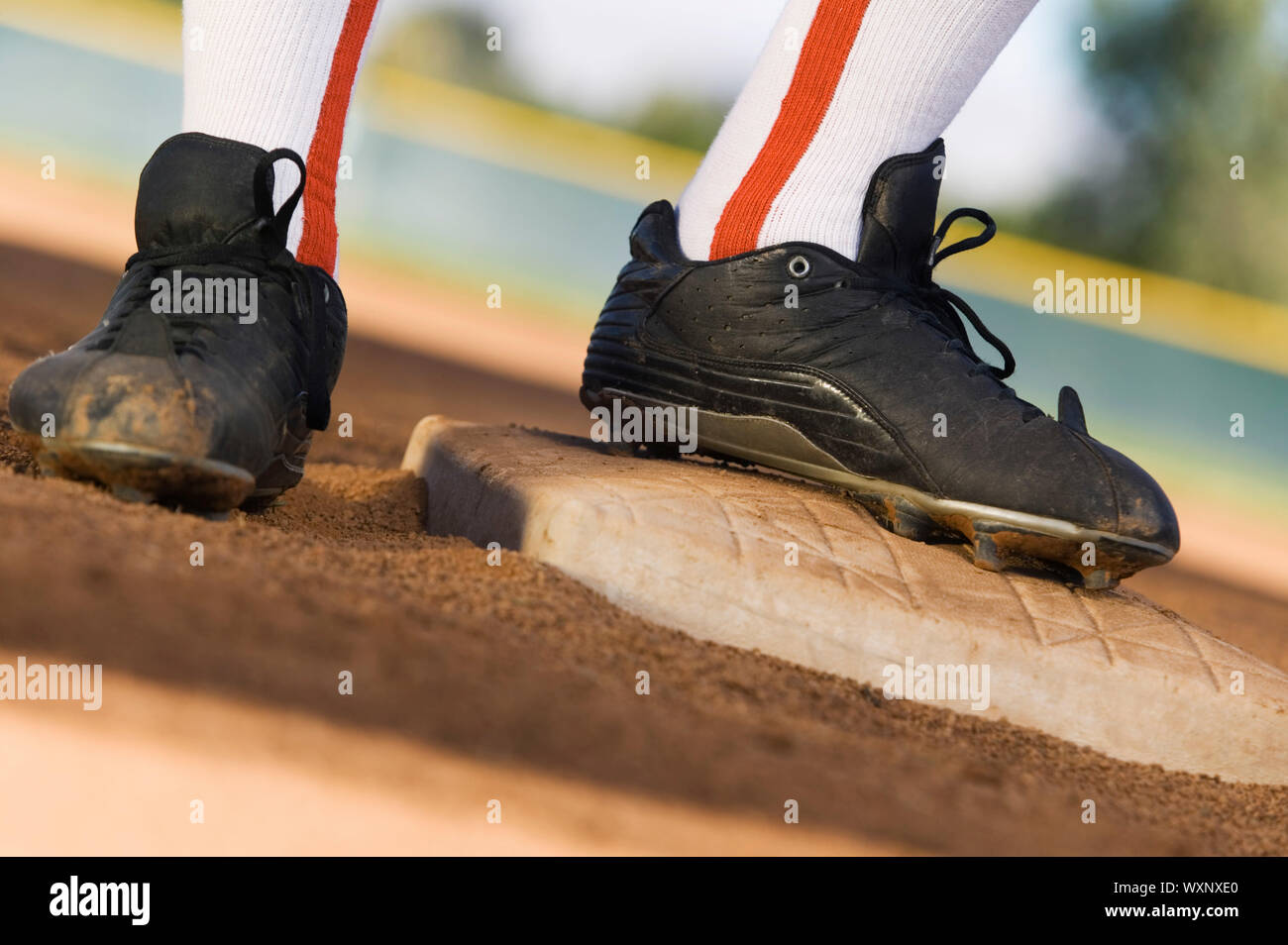 Baseball Player Standing on Base Stock Photo - Alamy