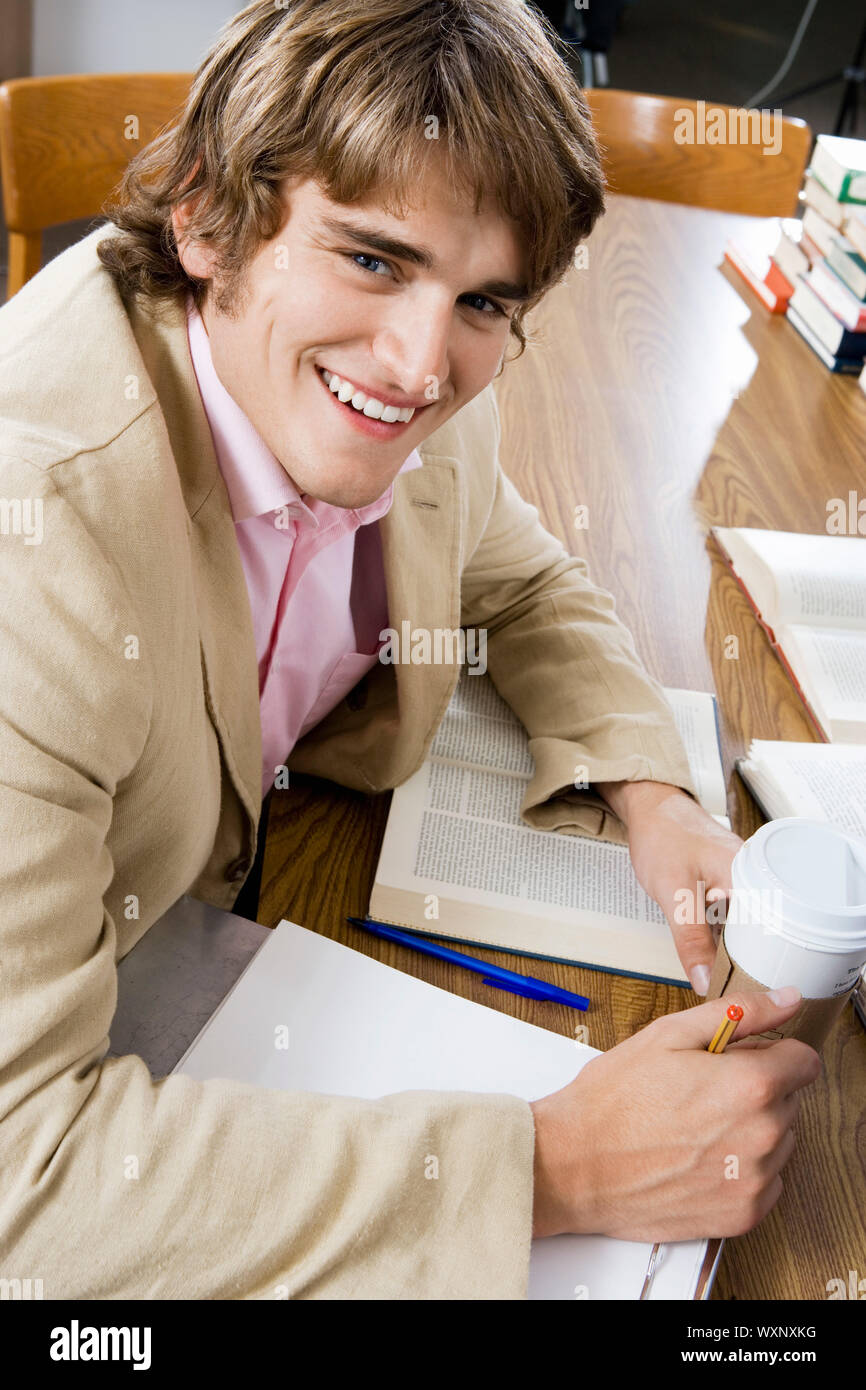 Studying alone in a library hi-res stock photography and images - Alamy
