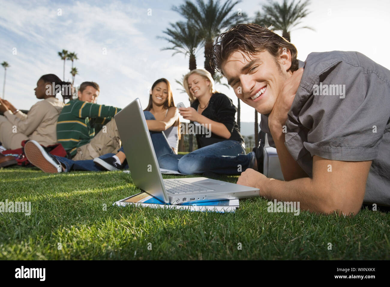 College Students Studying in the Grass Stock Photo - Alamy