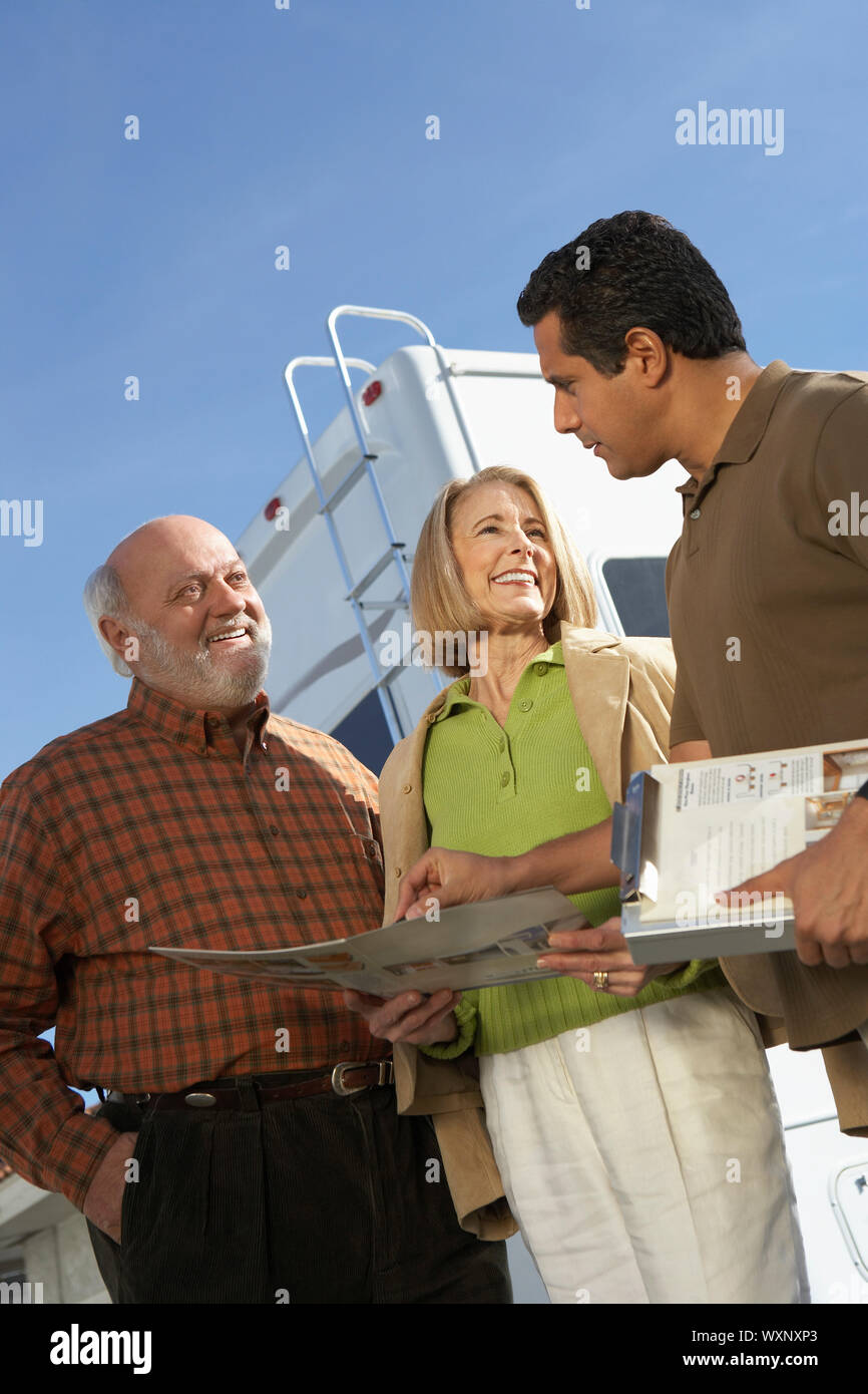 Salesperson Talking to Customers Stock Photo - Alamy