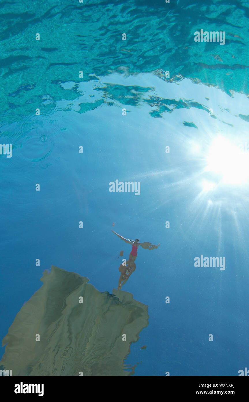 Reflection of Person Diving Into a Pool Stock Photo - Alamy