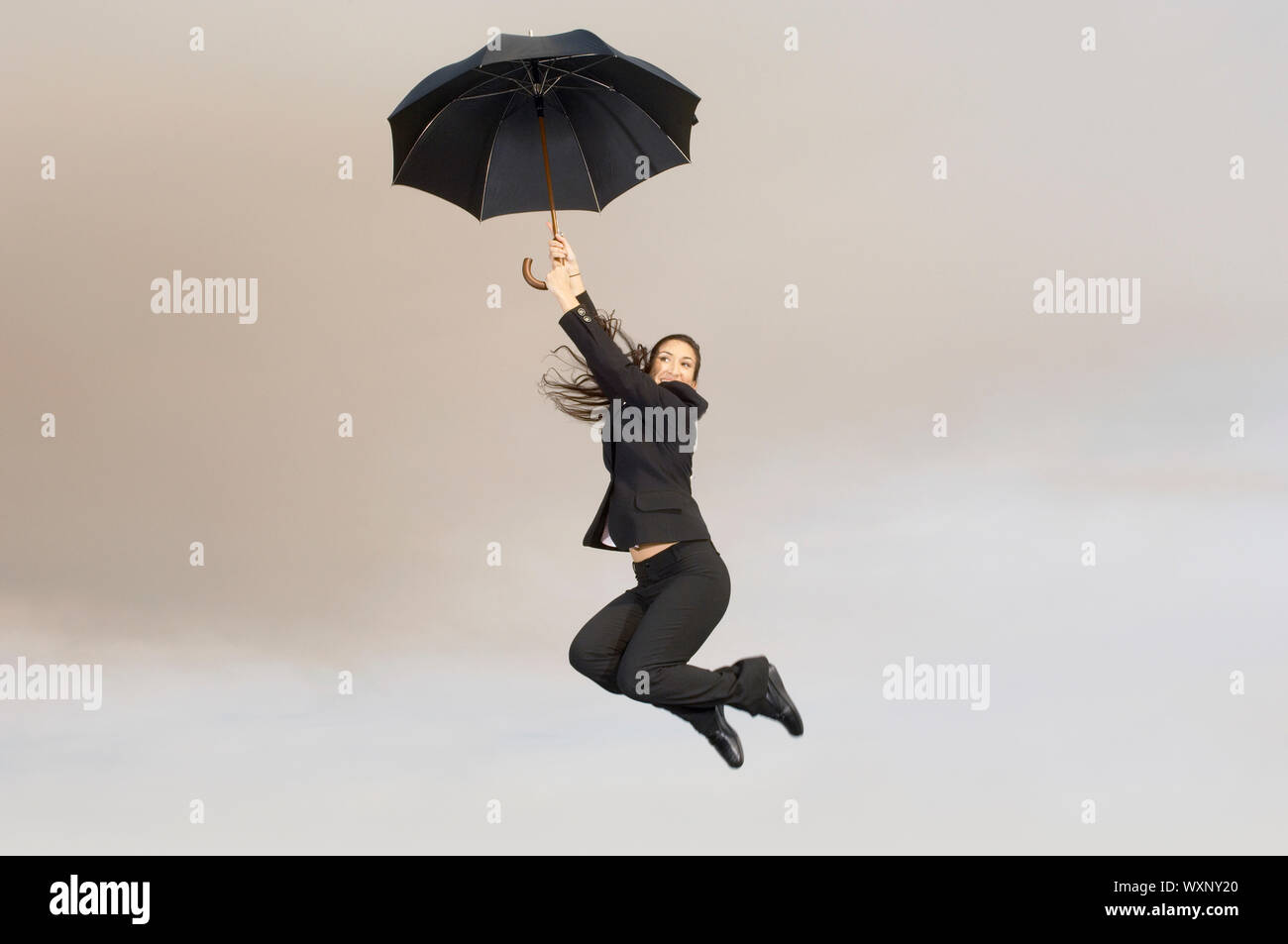 Falling Woman with Umbrella Stock Photo - Alamy