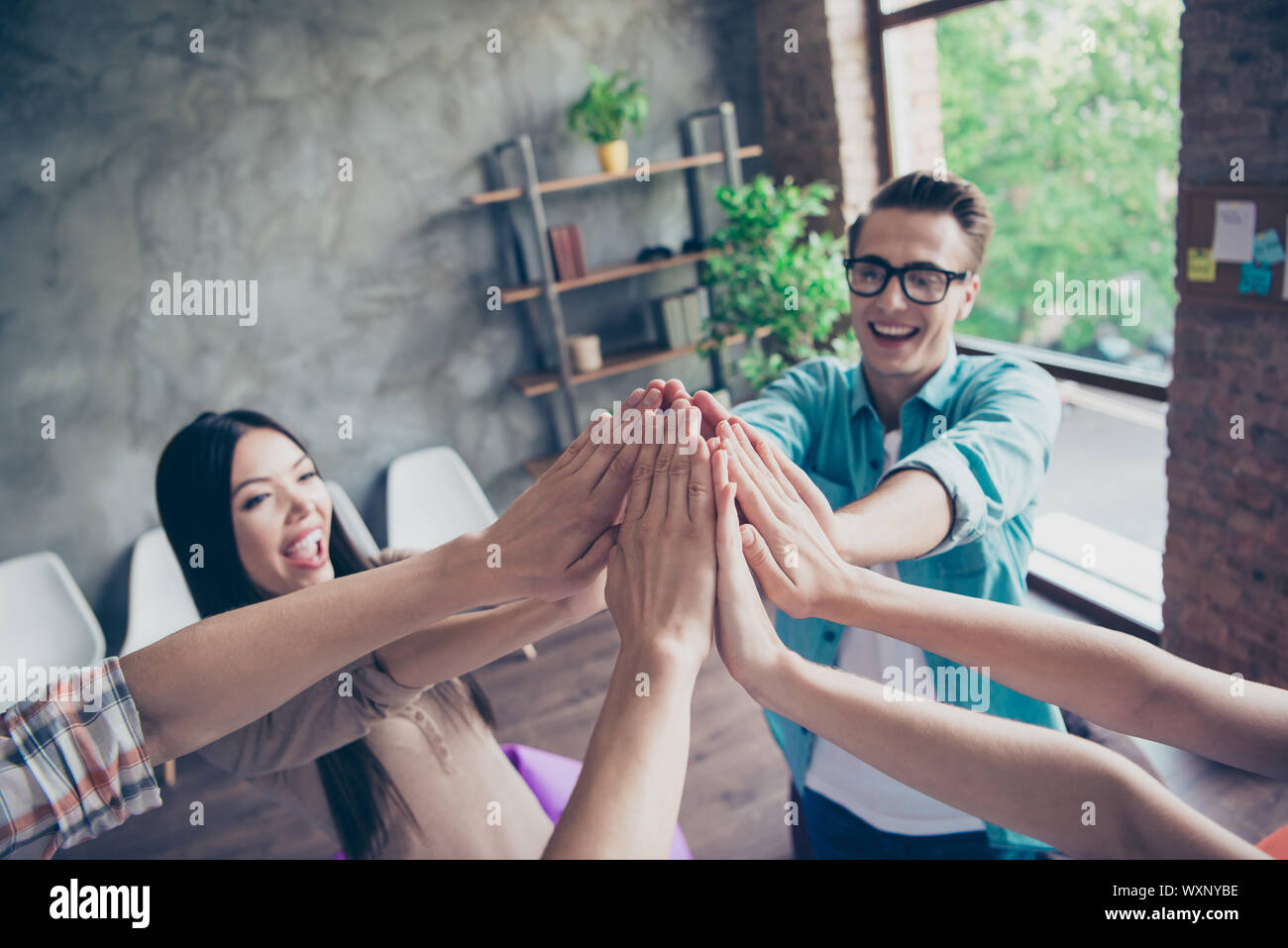 Close-up photo of four people gathering hands, adorable smart, c Stock ...