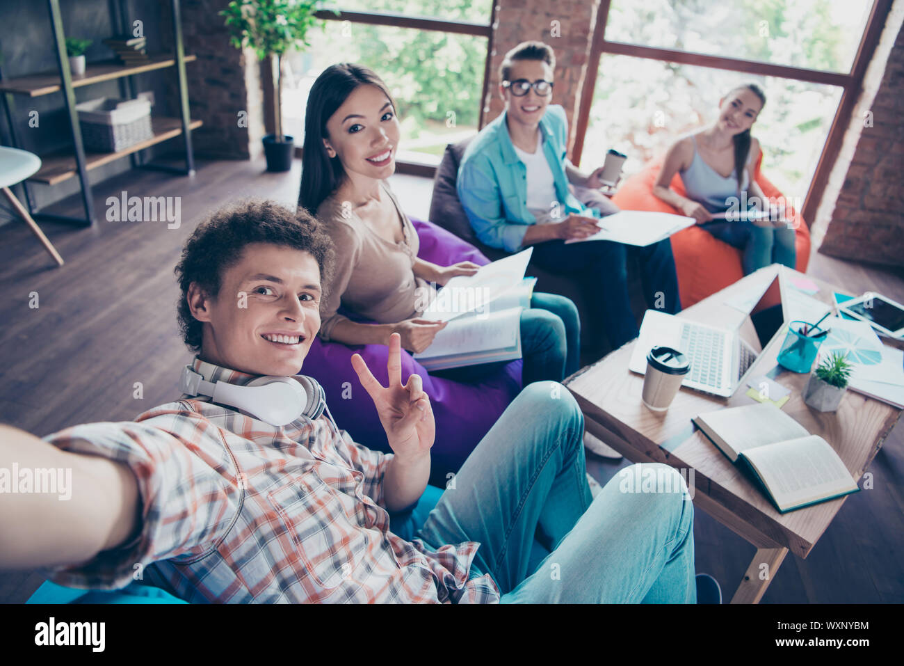 Self-photo of four nice adorable smart, clever, intelligent peop Stock ...