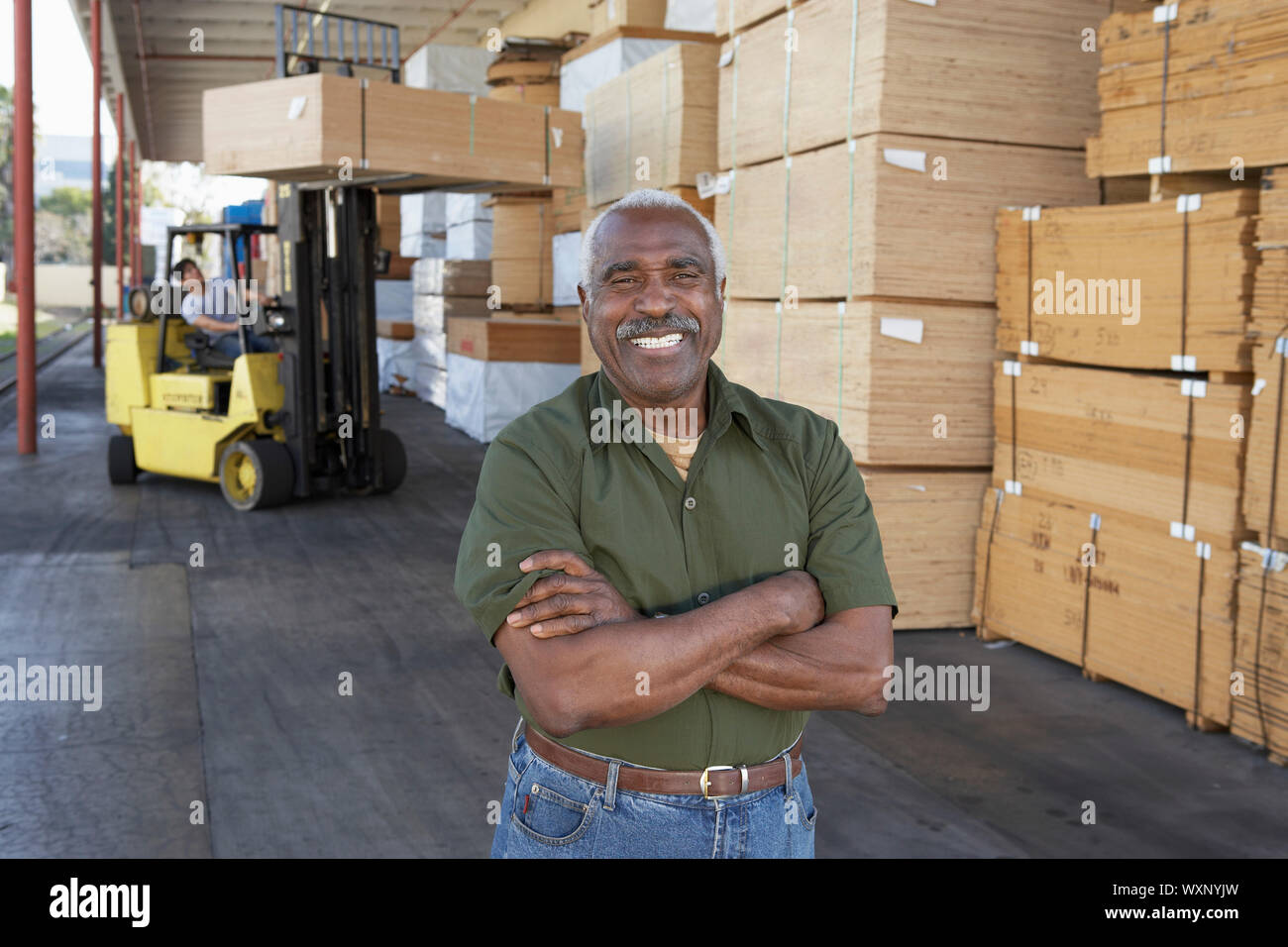Warehouse Worker at Loading Dock of Lumber Warehouse Stock Photo - Alamy