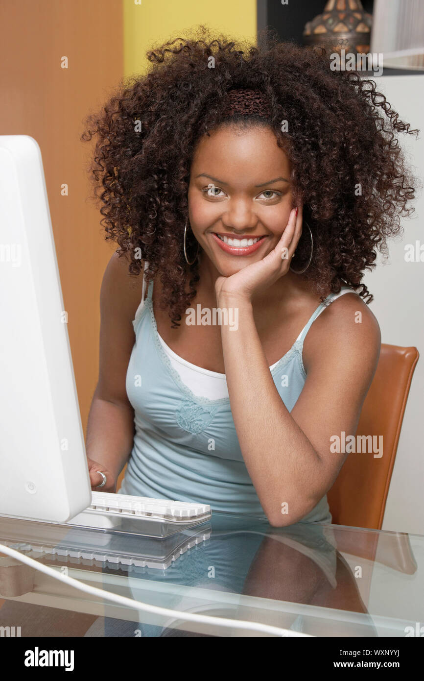 Woman looking at flatscreen hi-res stock photography and images - Alamy