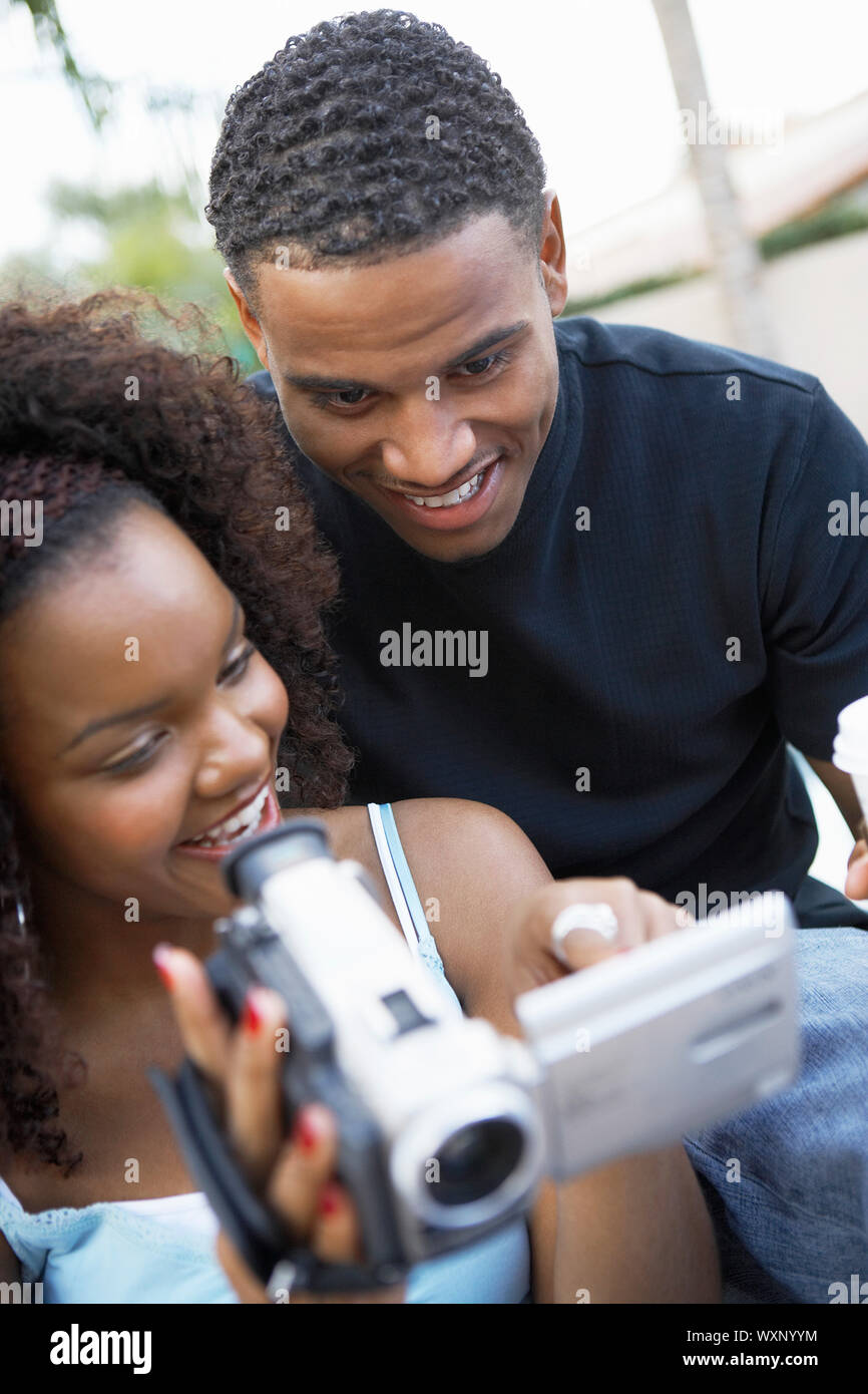 Couple with Video Camera Stock Photo - Alamy