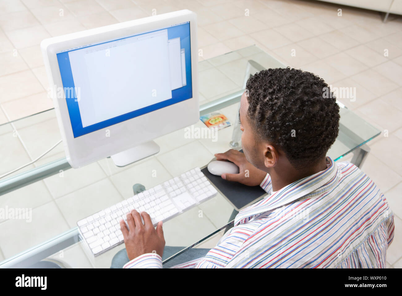 Young Man Using Desktop Computer Stock Photo - Alamy