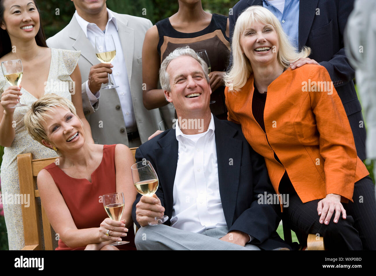 Middle aged friends socializing outdoors hi-res stock photography and ...