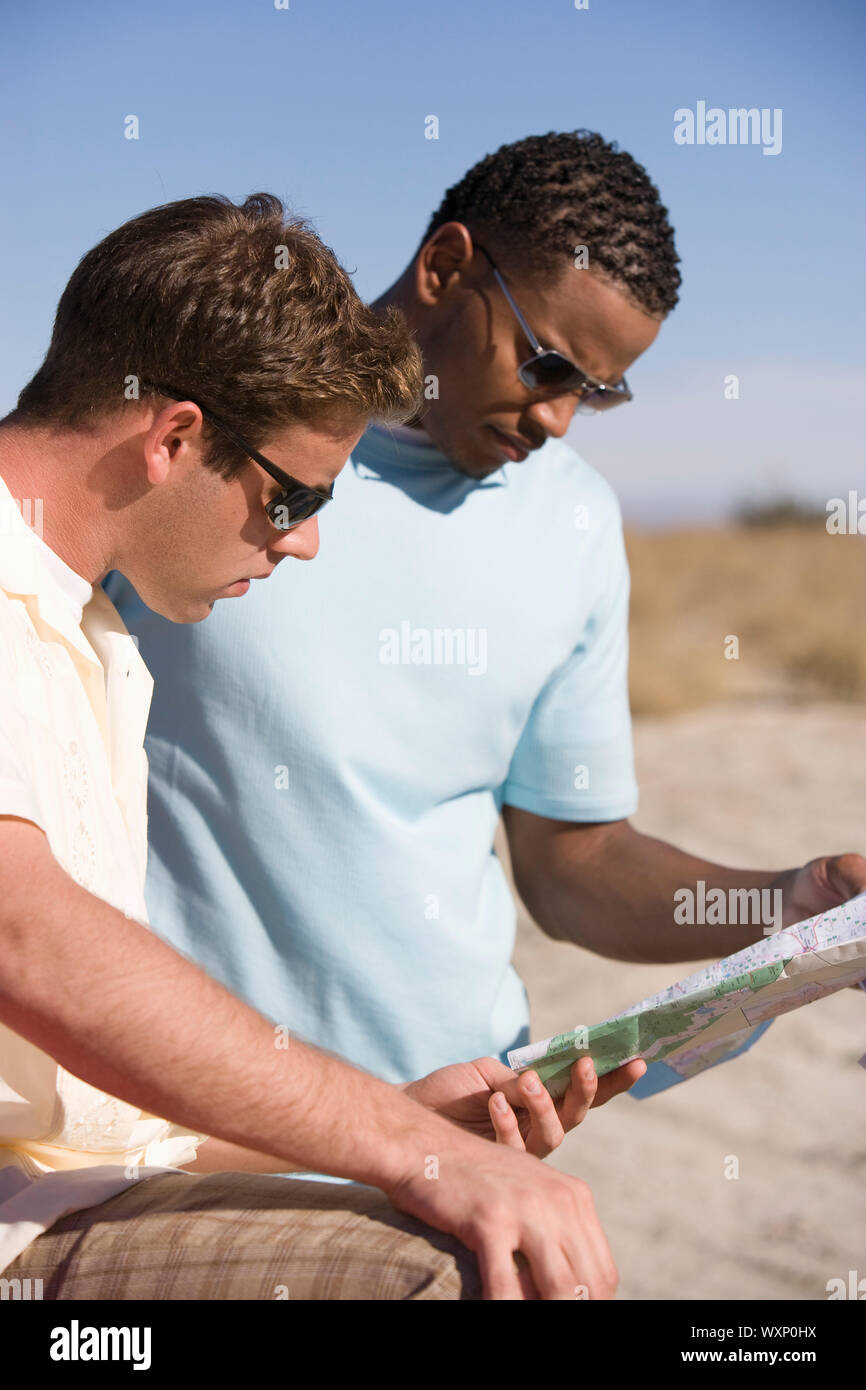 Men Looking at Road Map Stock Photo - Alamy