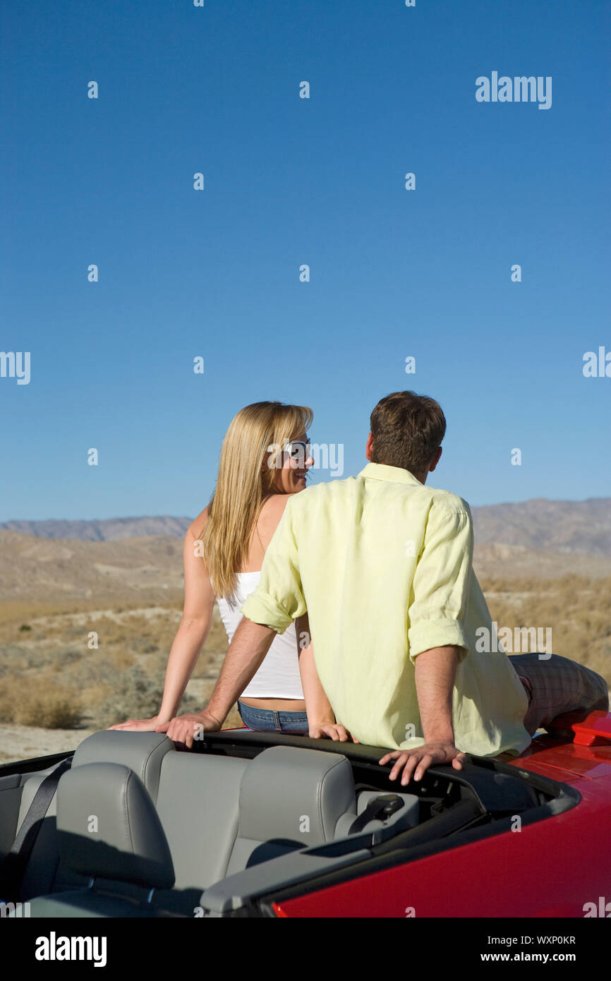 Couple Taking a Break from Driving Stock Photo - Alamy