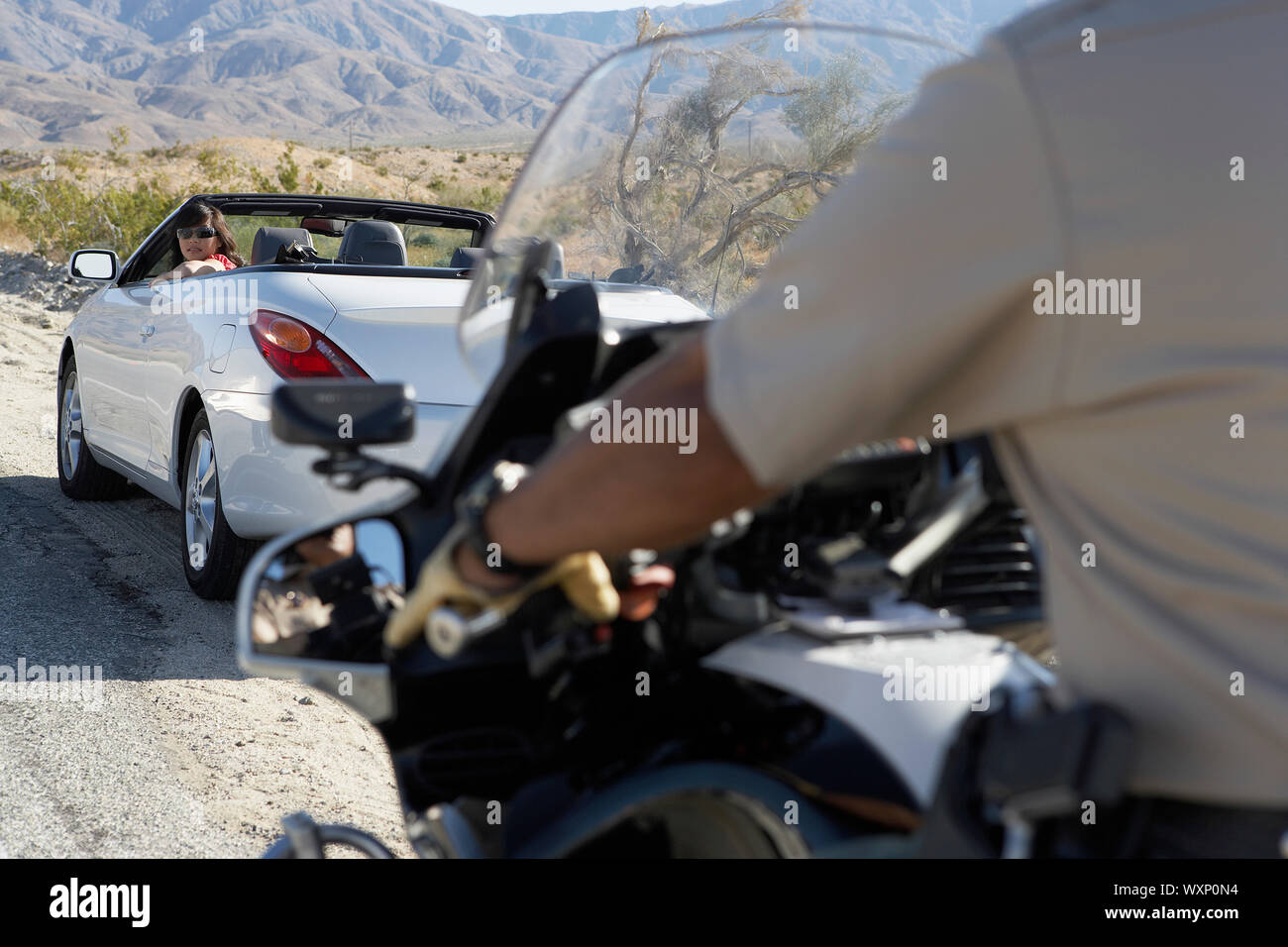 Police Officer Stopping a Speeding Car Stock Photo - Alamy