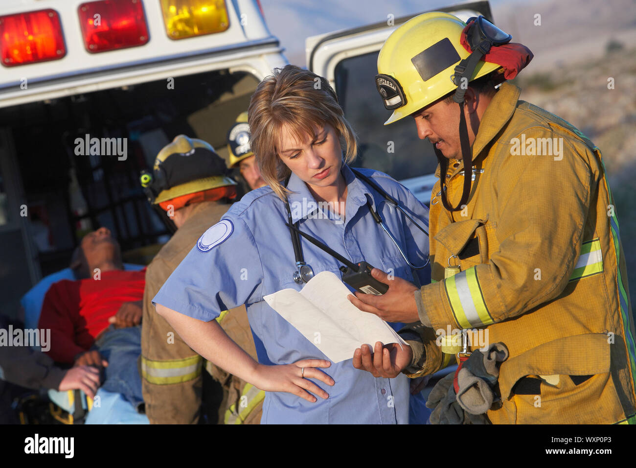 Fireman rescuing woman hi-res stock photography and images - Alamy