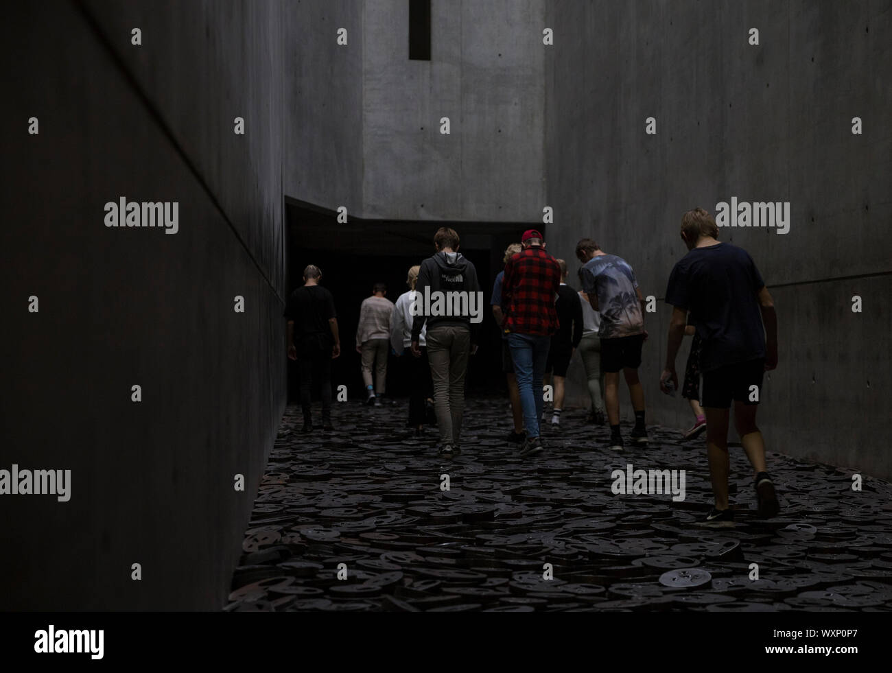 People visiting the Fallen Leaves installation in the Memory Void at ...
