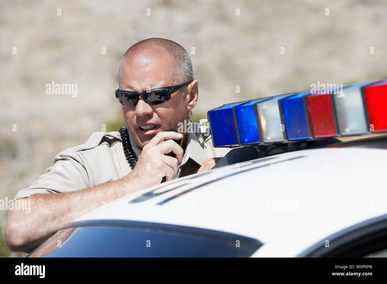 Police Officer on Two-Way Radio Stock Photo - Alamy