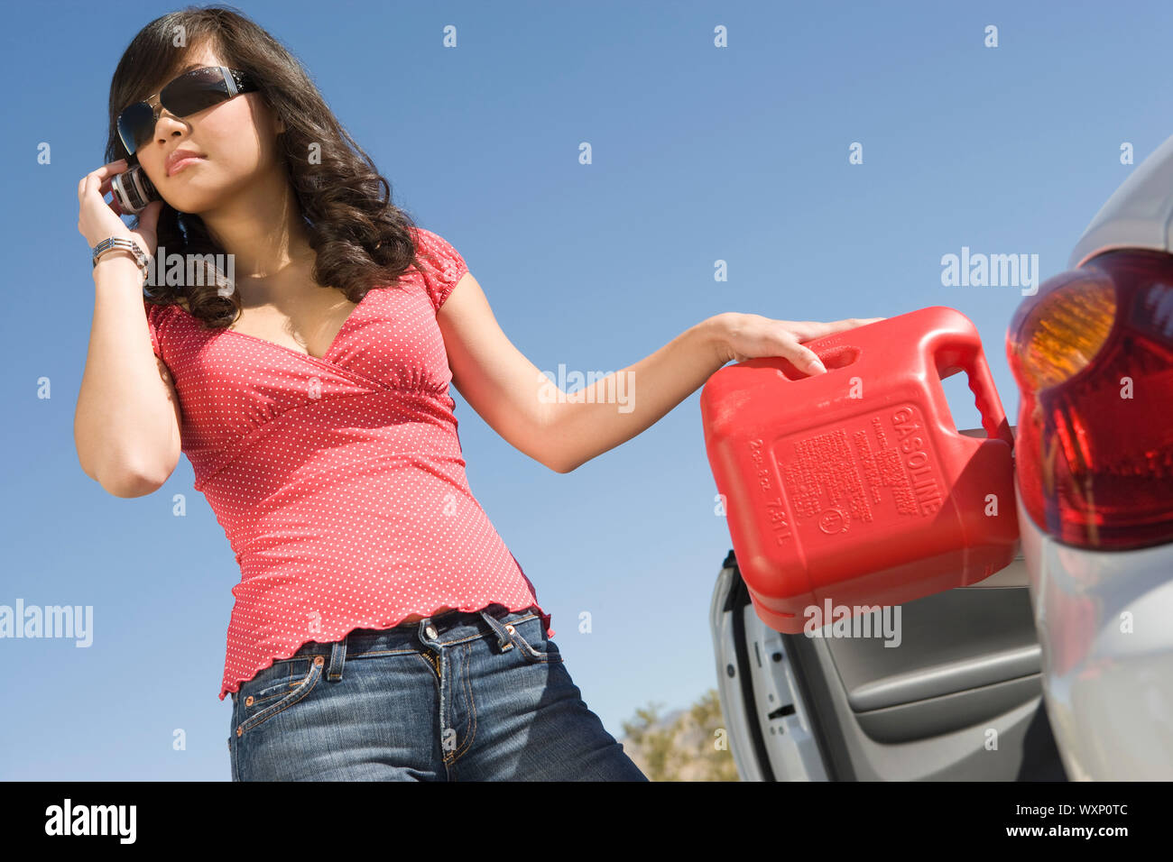 Woman refuelling car hi-res stock photography and images - Alamy