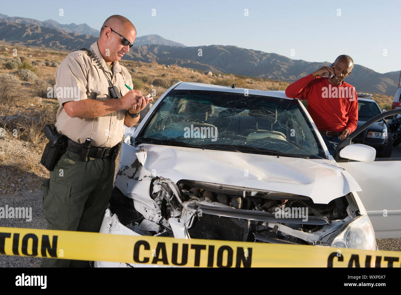 Police officer and driver with damaged car Stock Photo - Alamy