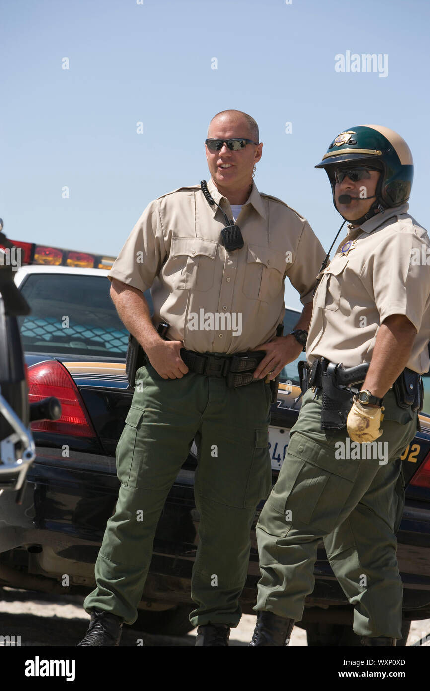 Police officers talking Stock Photo - Alamy