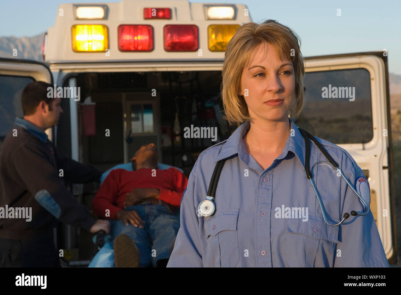 Paramedic by ambulance Stock Photo - Alamy