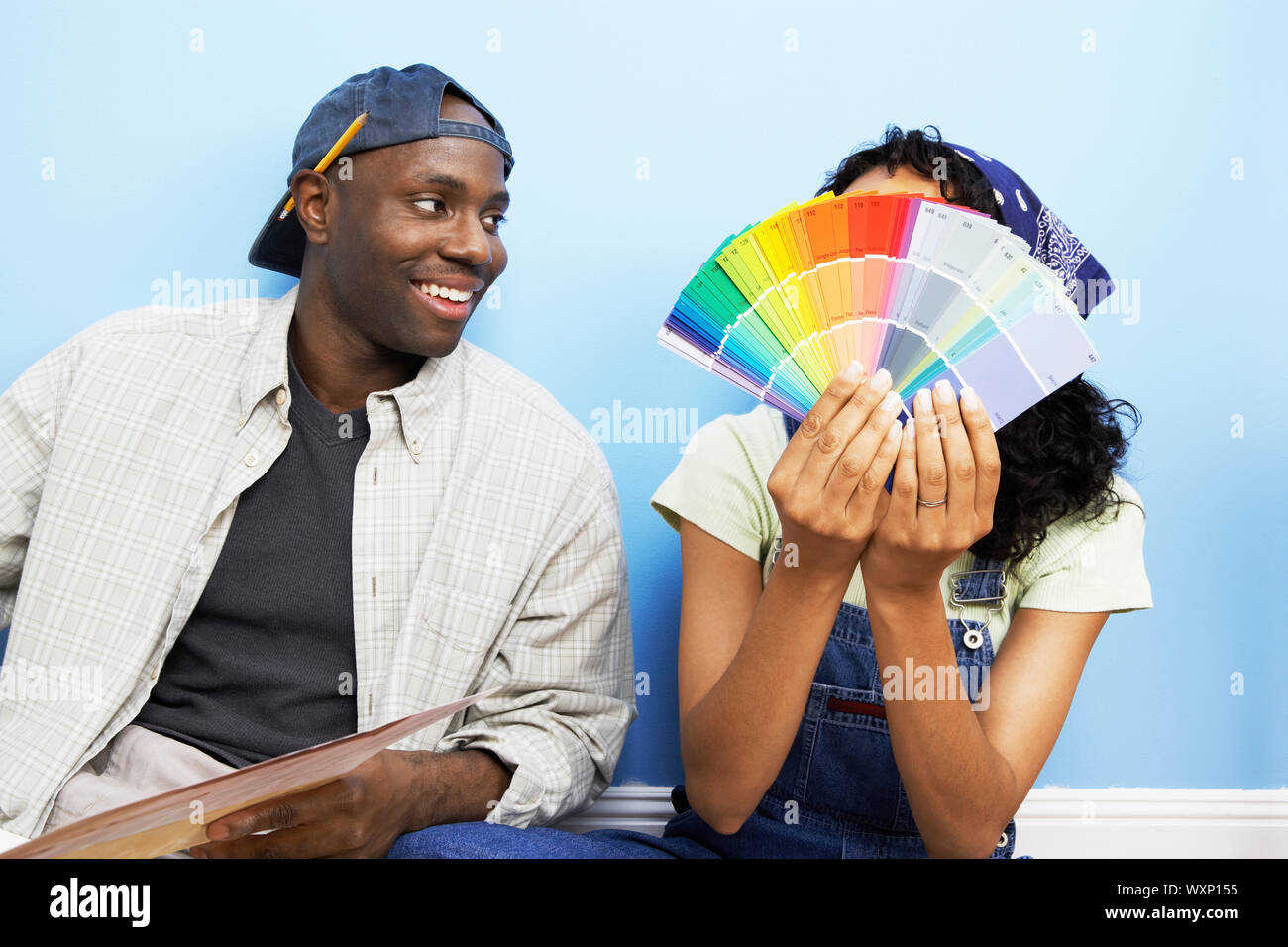 Couple Choosing Paint Color Stock Photo - Alamy