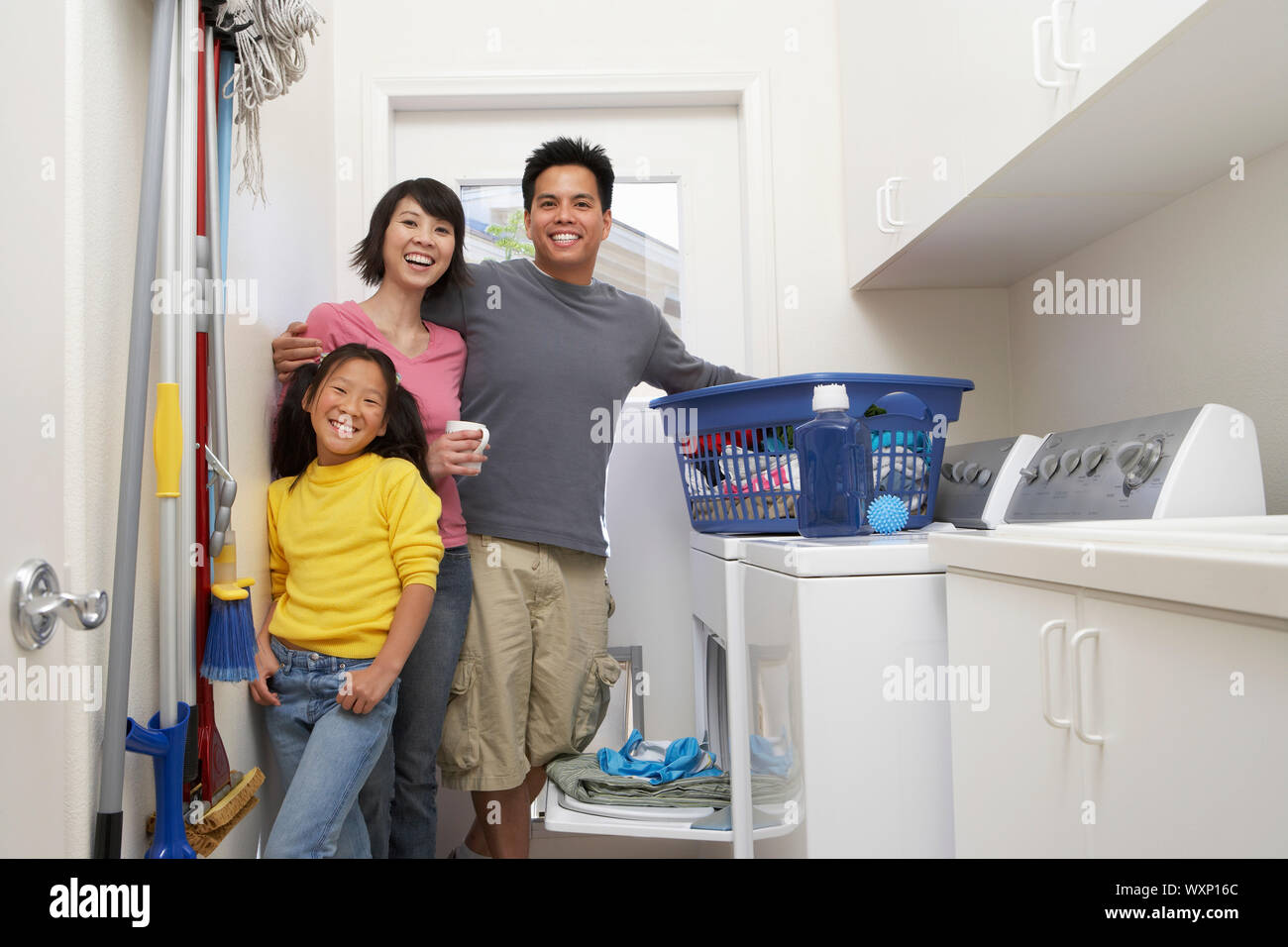 Family Doing Laundry Stock Photo - Alamy