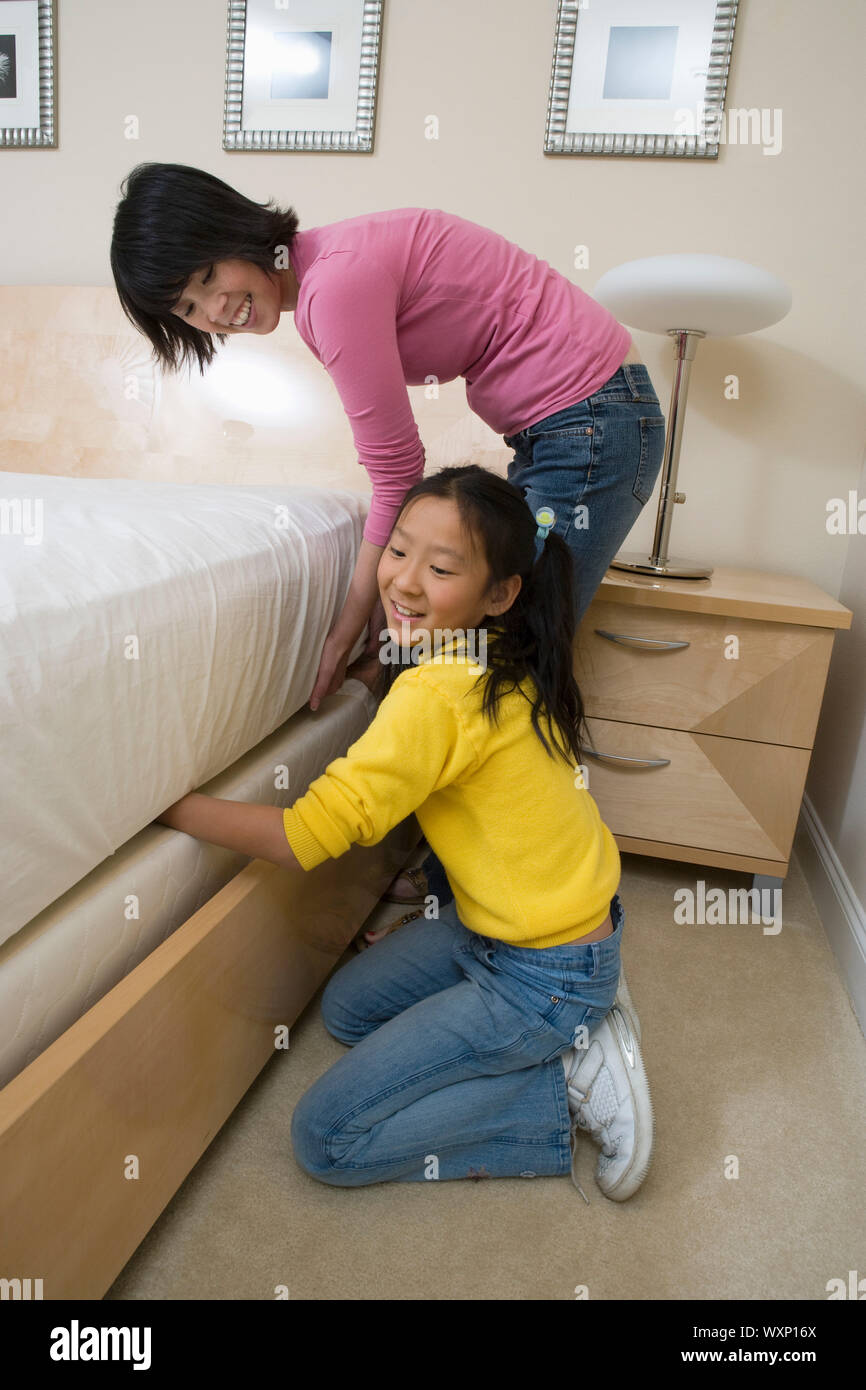 Teen child making bed hi-res stock photography and images - Alamy