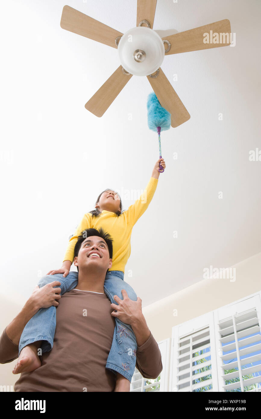 Brother and sister cleaning the house hi-res stock photography and ...