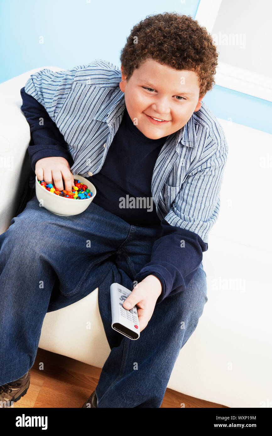 Overweight Child Eating Junk Food Stock Photo - Alamy