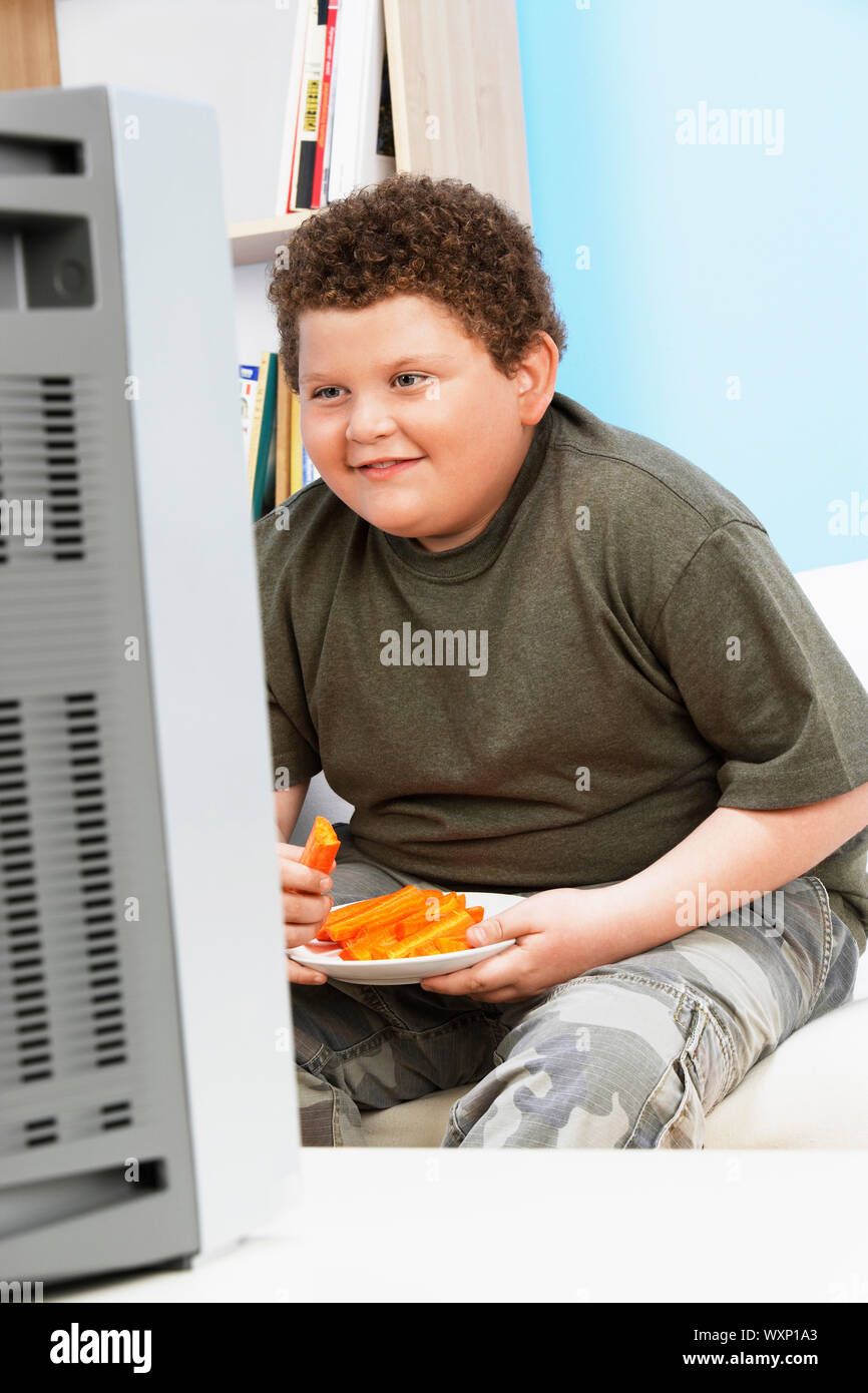 Overweight child eating well hi-res stock photography and images - Alamy