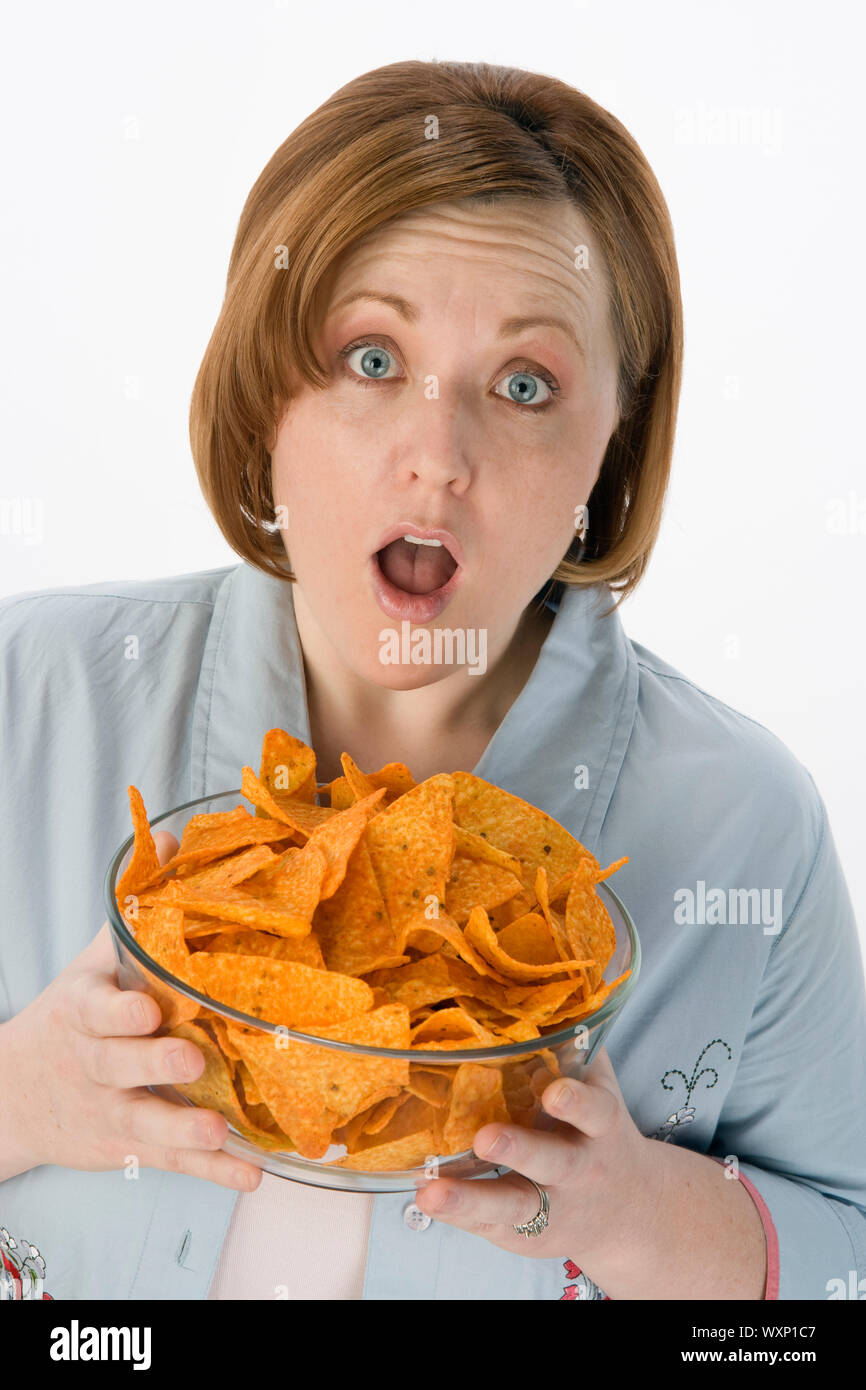 Woman eating chips head and shoulders hi-res stock photography and ...