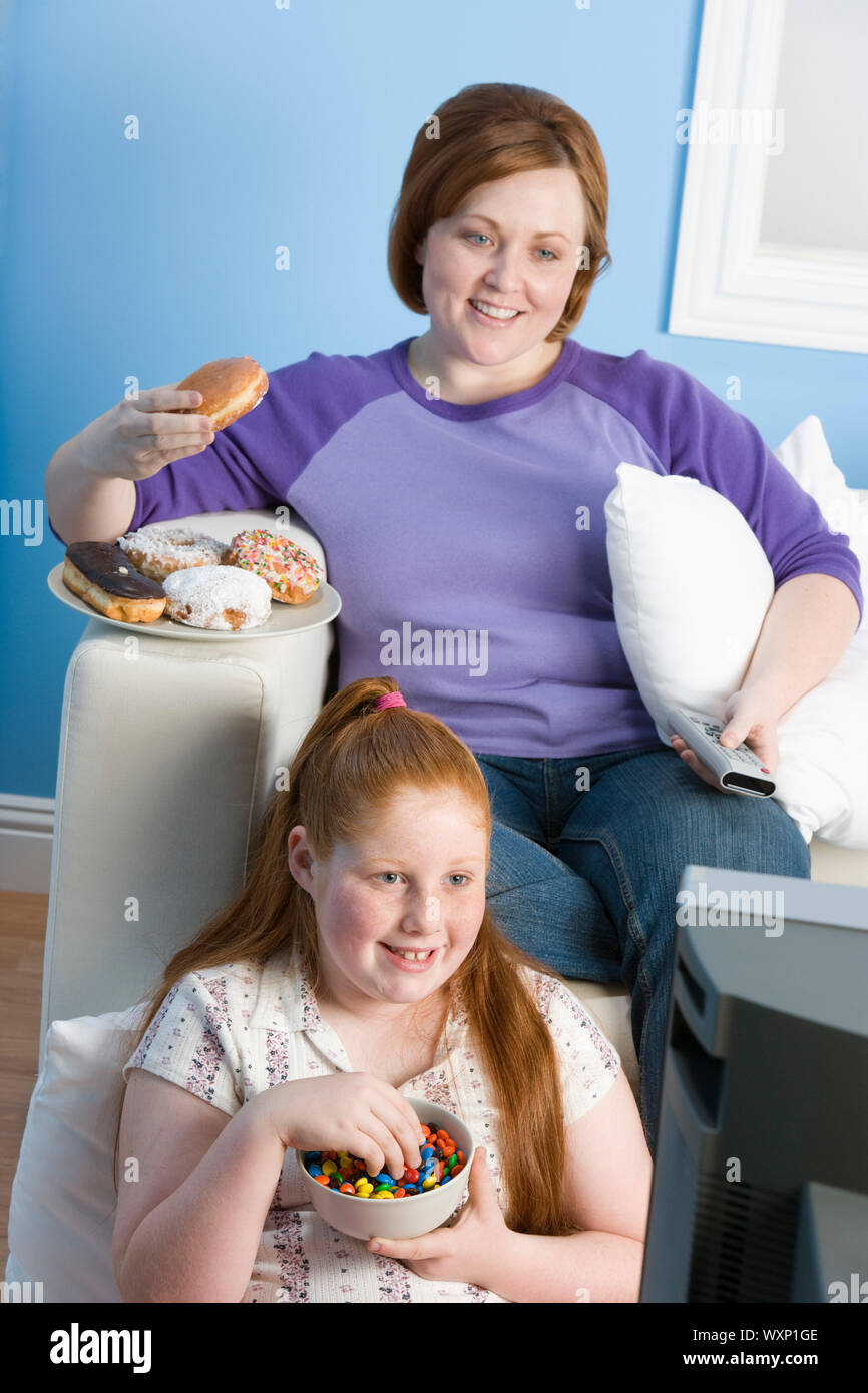 Overweight mother daughter sofa hi-res stock photography and images - Alamy