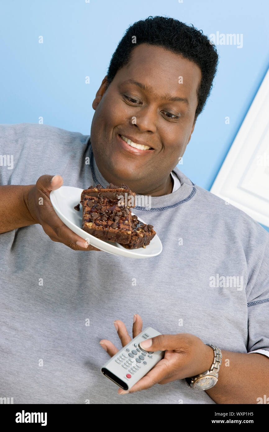 Man Eating Brownies Stock Photo - Alamy